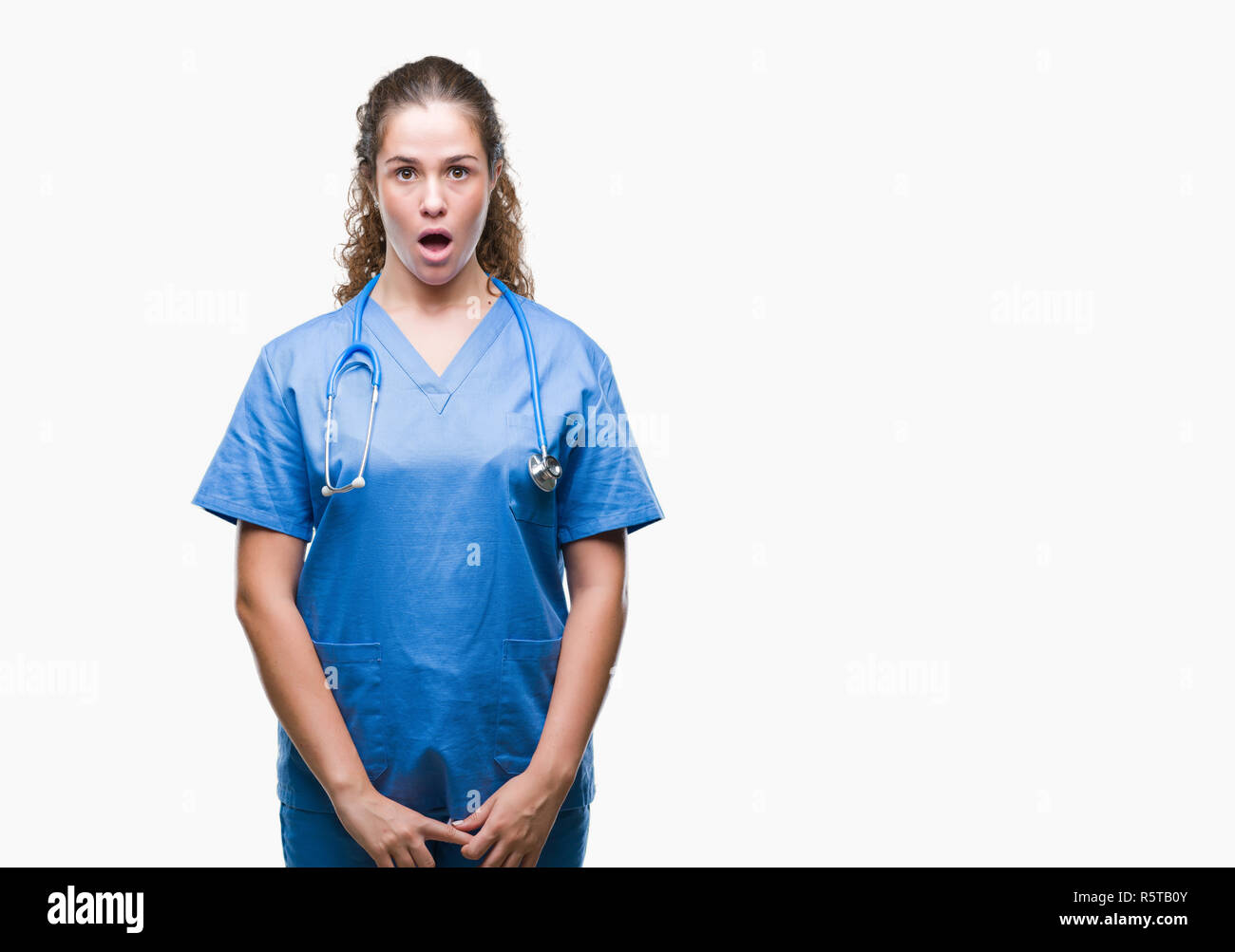Young brunette doctor girl wearing nurse or surgeon uniform over ...
