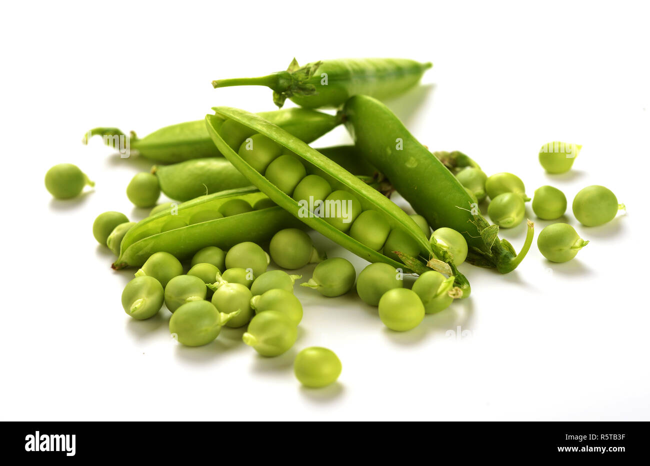 Ripe pea vegetable on white background Stock Photo - Alamy