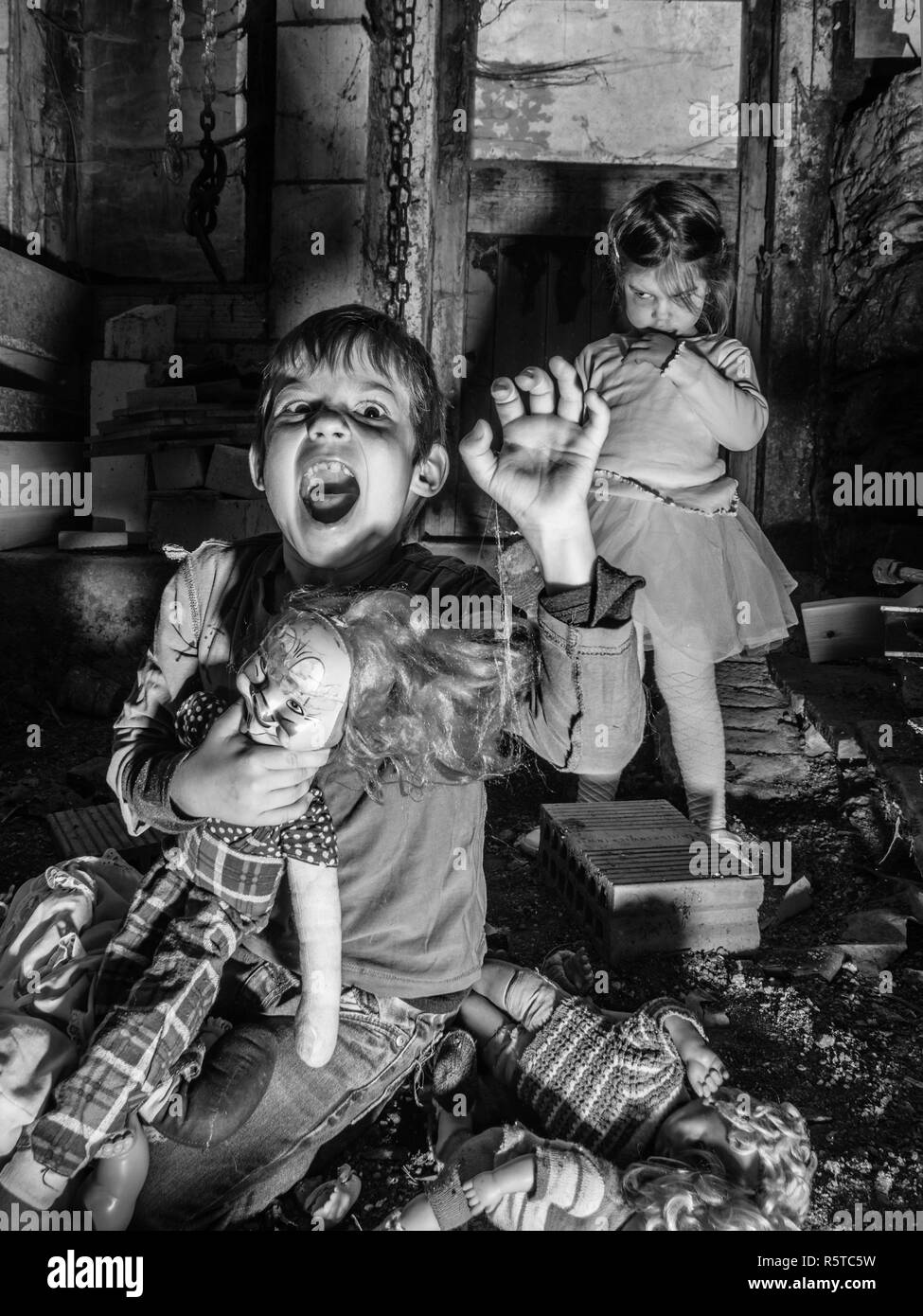 Creepy children and scary dolls in the barn Stock Photo - Alamy