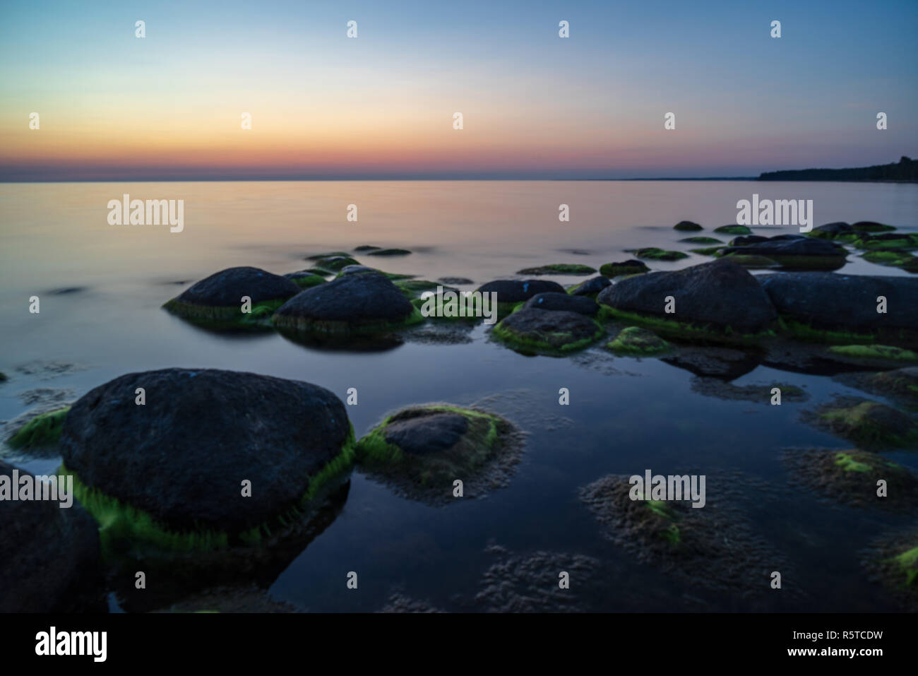 large granite rock single in nature environment isolated from other ...