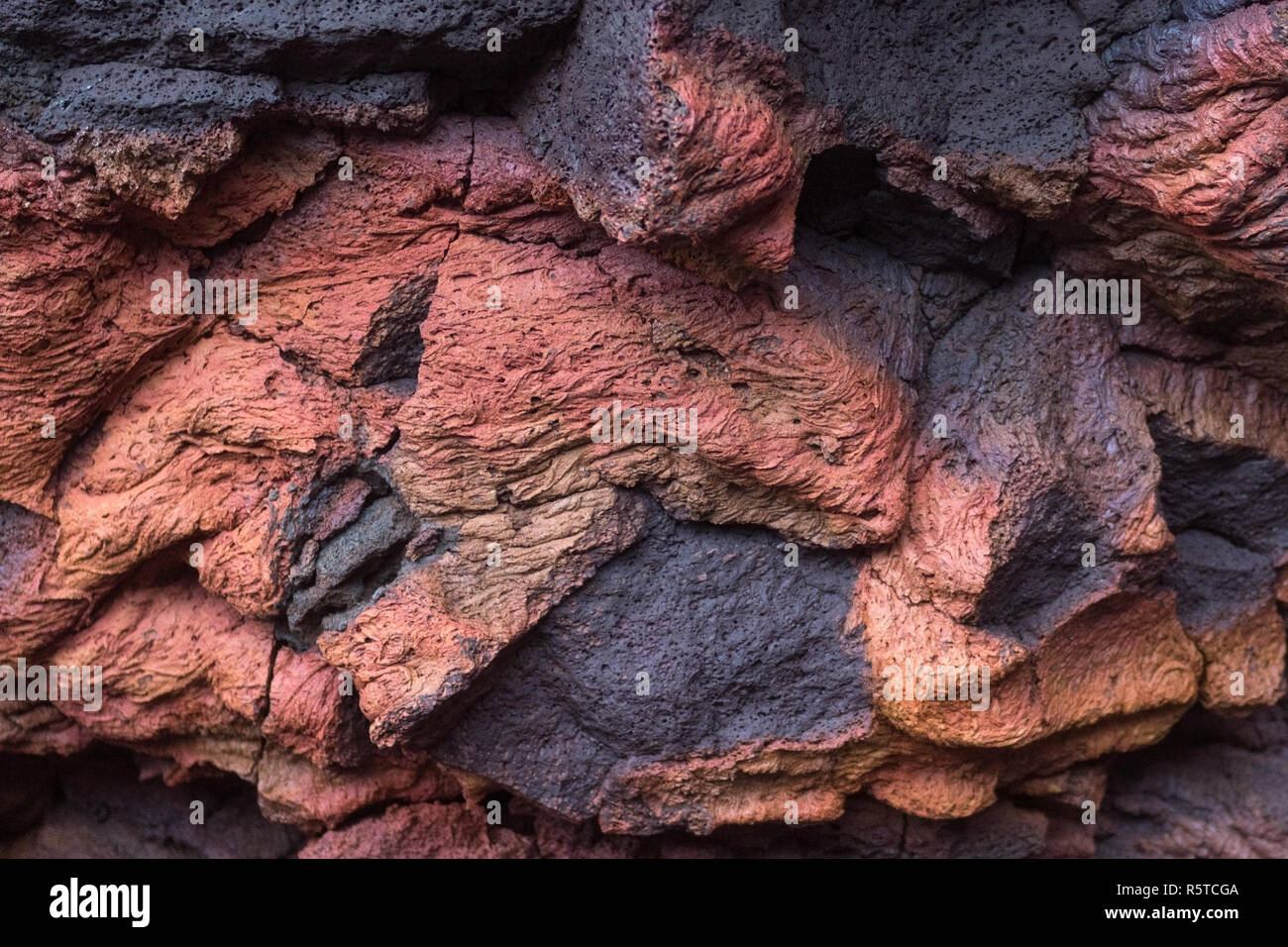 Solidified formations volcanic lava background Stock Photo - Alamy