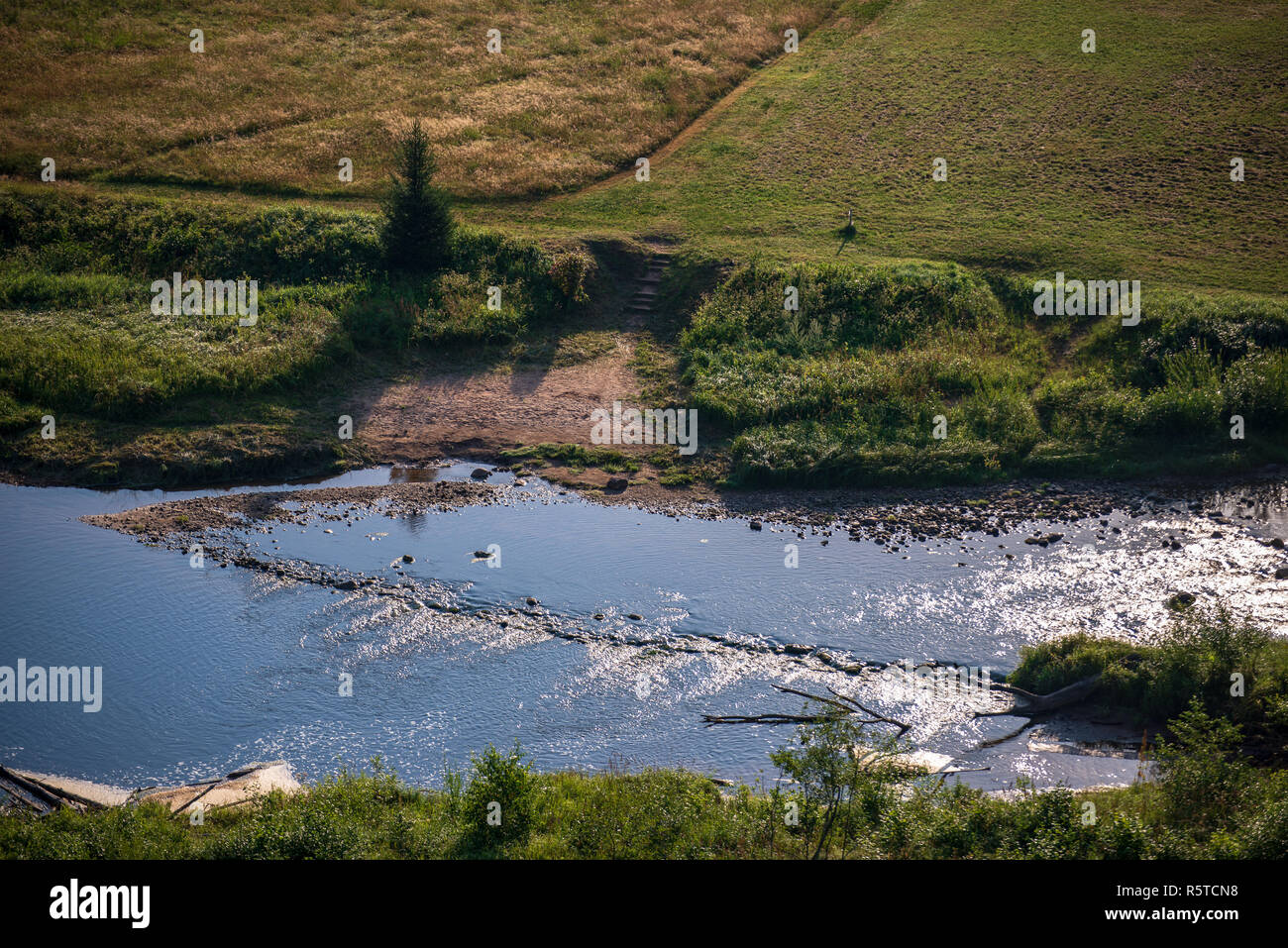 water stream in river of Amata in Latvia with sandstone cliffs, green ...