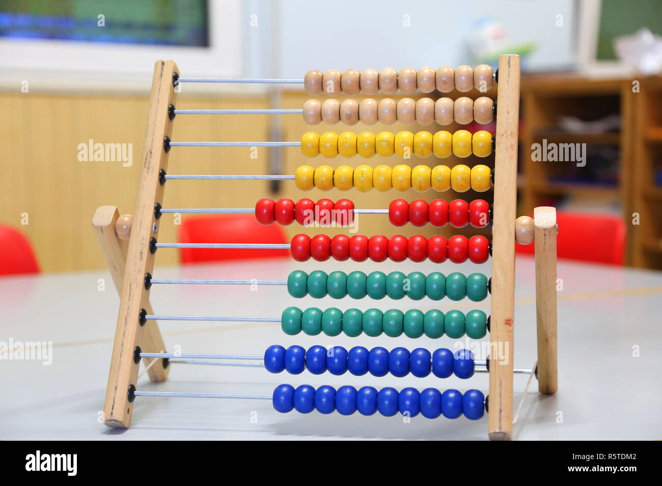 colorful wooden abacus used by school children to learn how to count ...