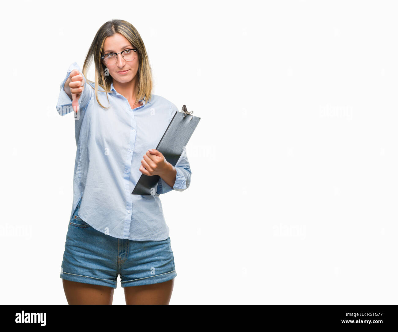 Young beautiful inspector business woman over isolated background with ...