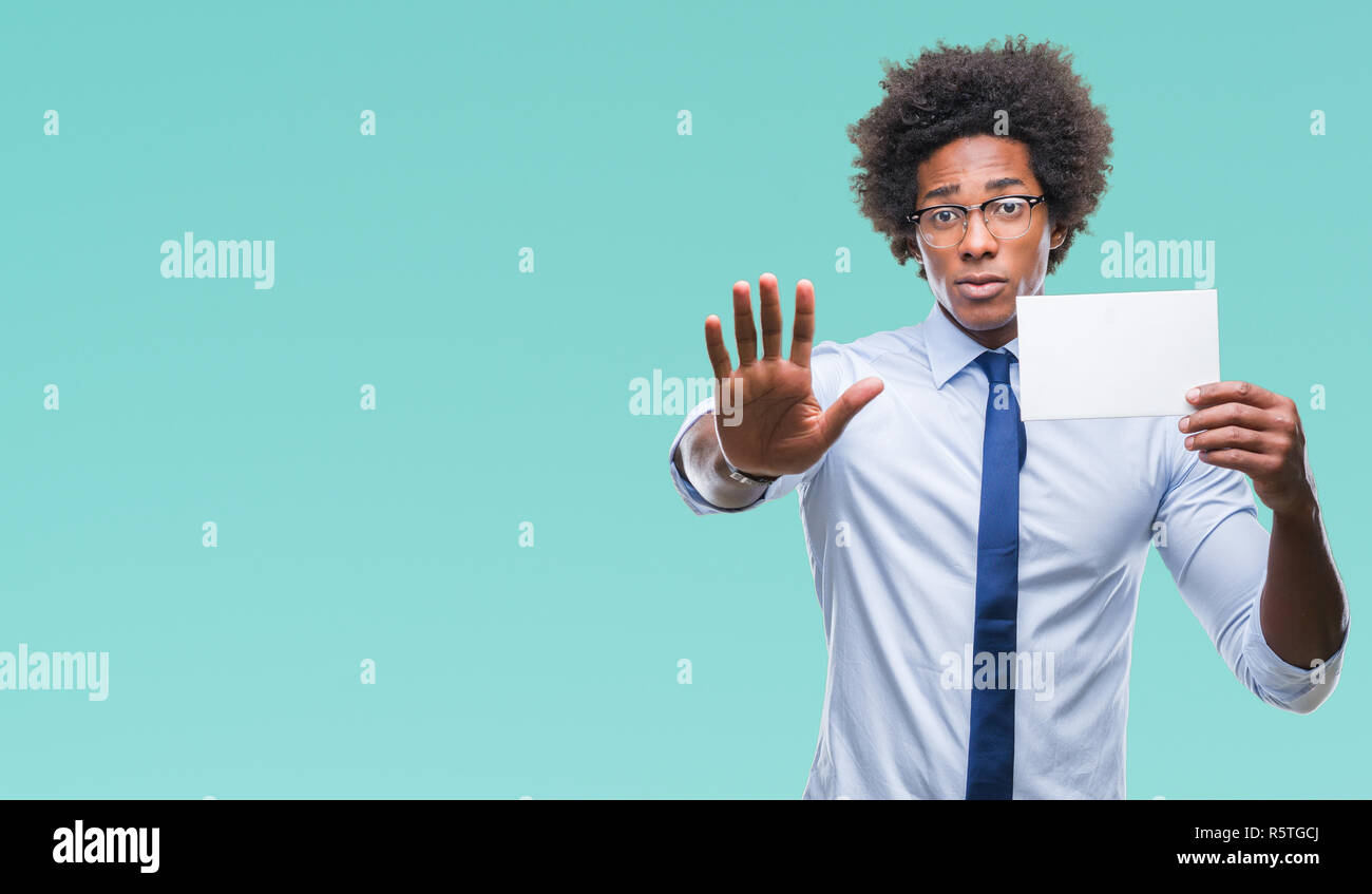 Afro american man holding blank card over isolated background with open ...