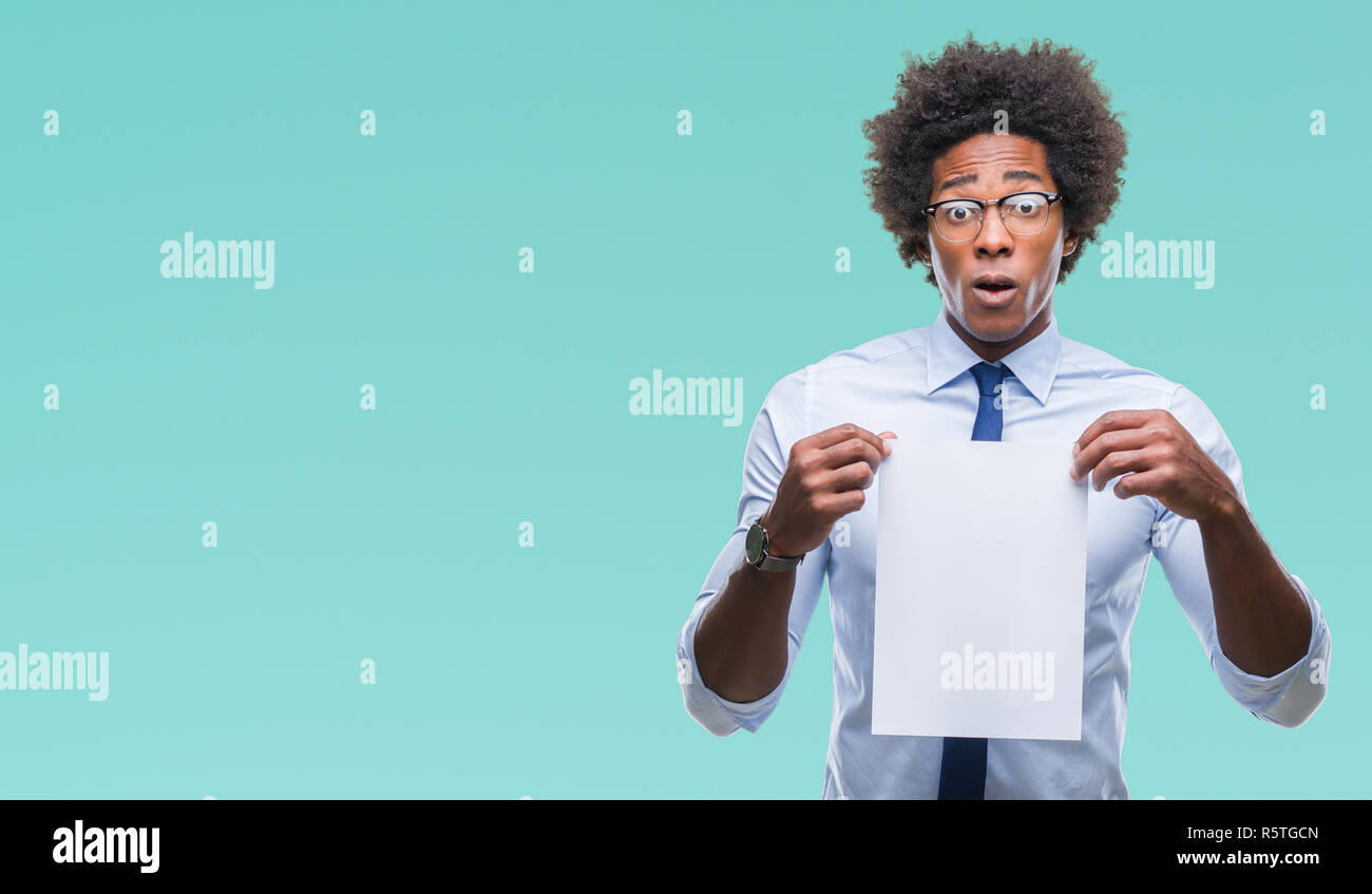 Afro american man holding blank paper contract over isolated background ...