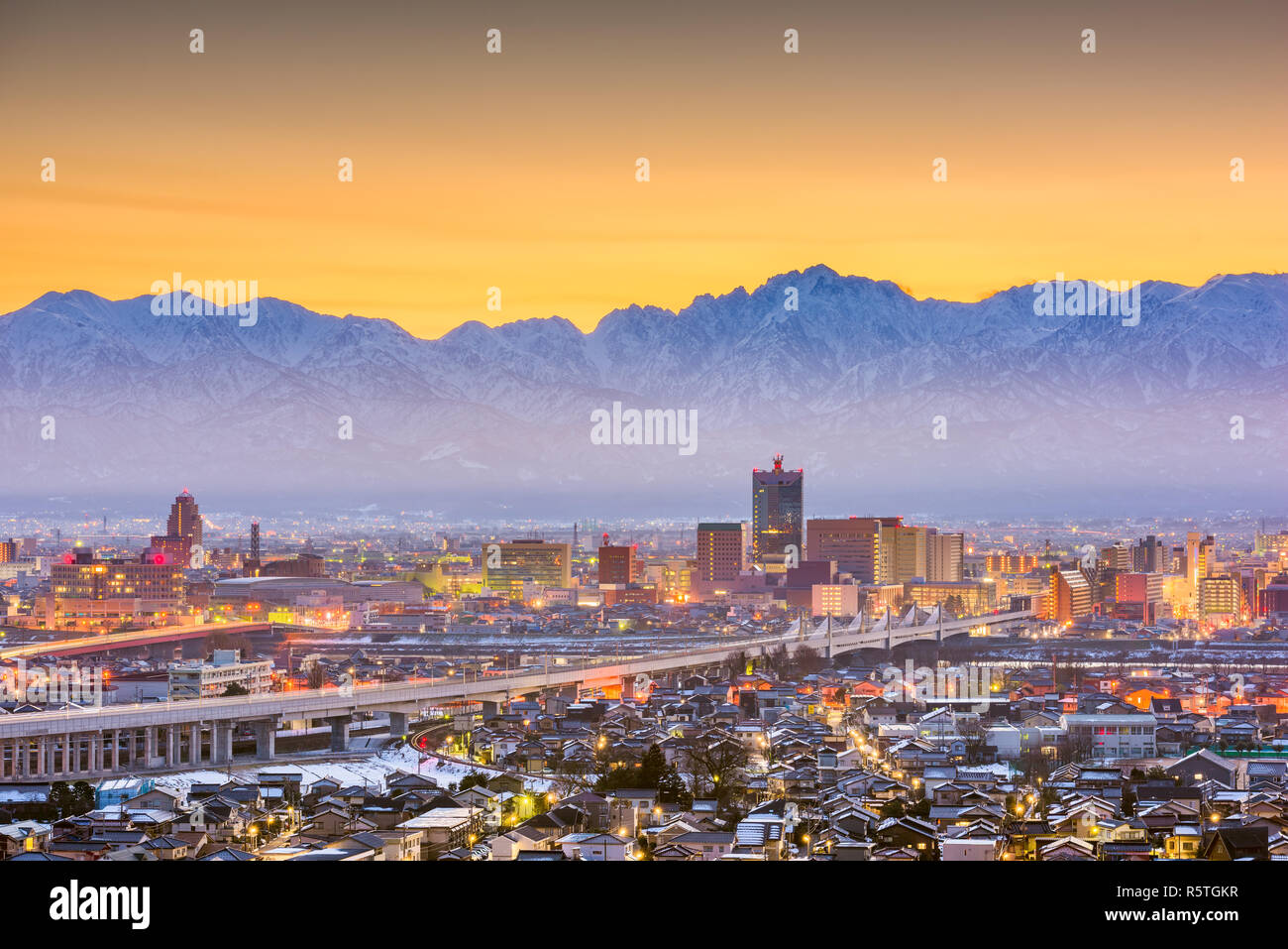 Toyama, Japan downtown city skyline with Tateyama Mountain at dawn ...