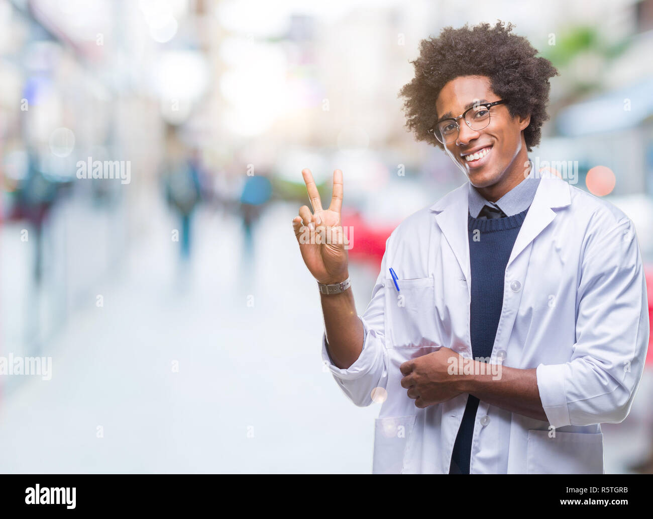 Afro american doctor scientist man over isolated background smiling ...