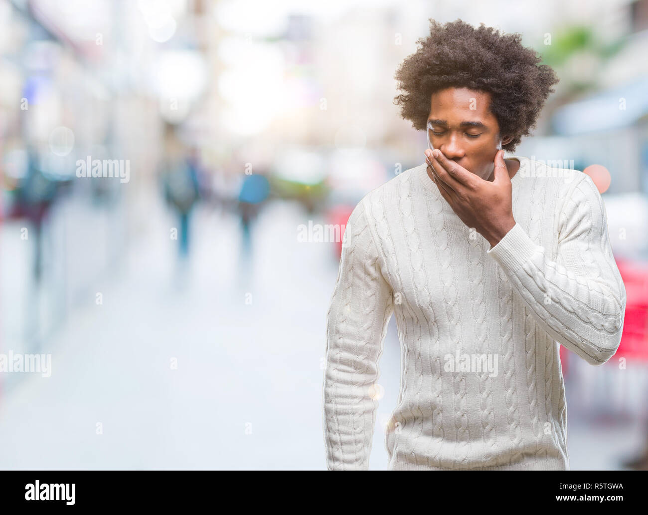 Afro american man over isolated background bored yawning tired covering ...