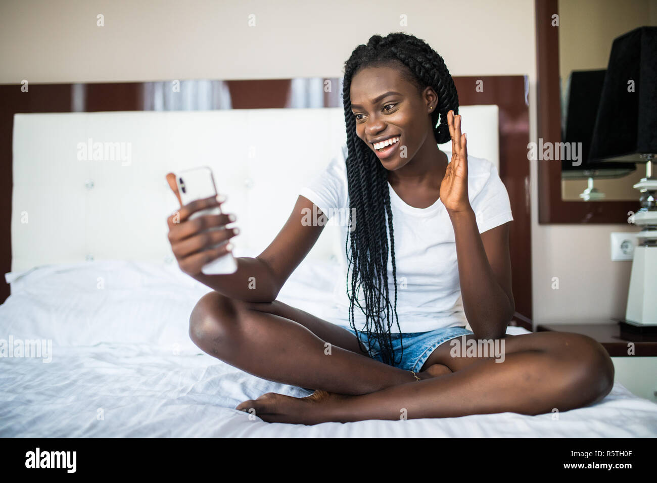 Woman shows on black smartphone hi-res stock photography and images - Alamy