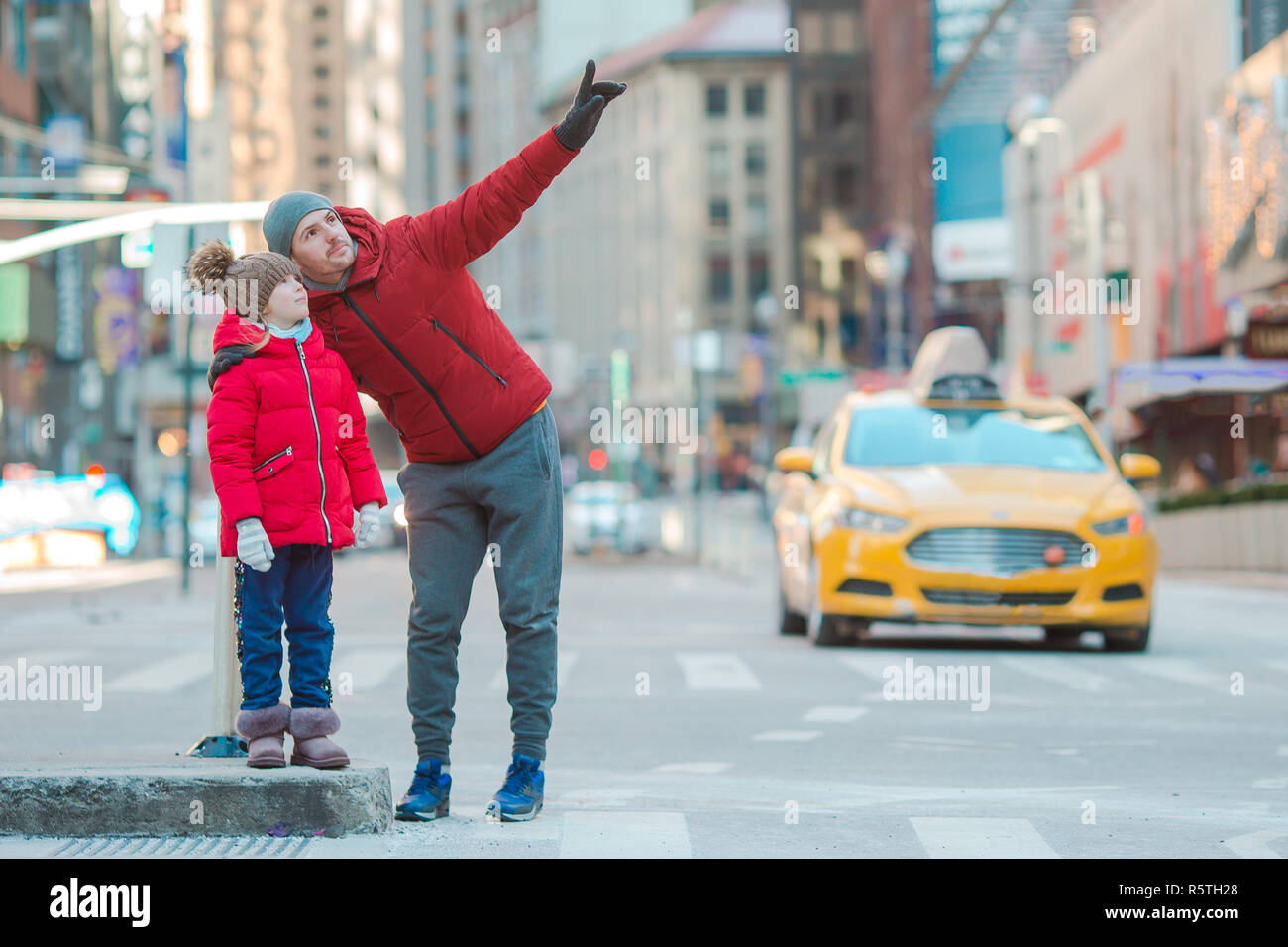 Family of father and little kid on Times Square during their vacation ...
