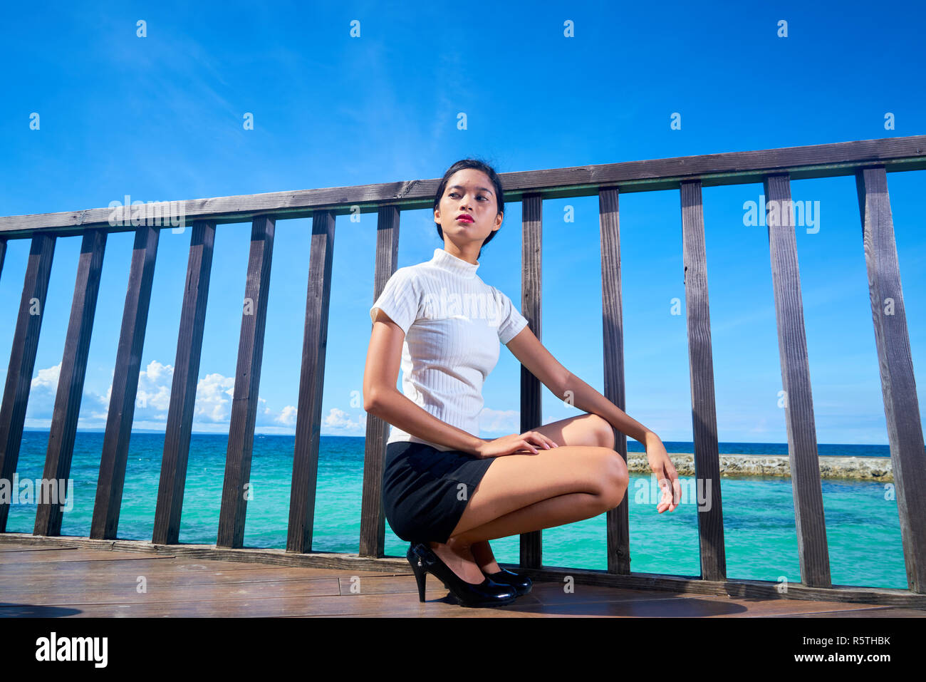 Beautiful woman posing - sitting, looking far away and thinking Stock ...