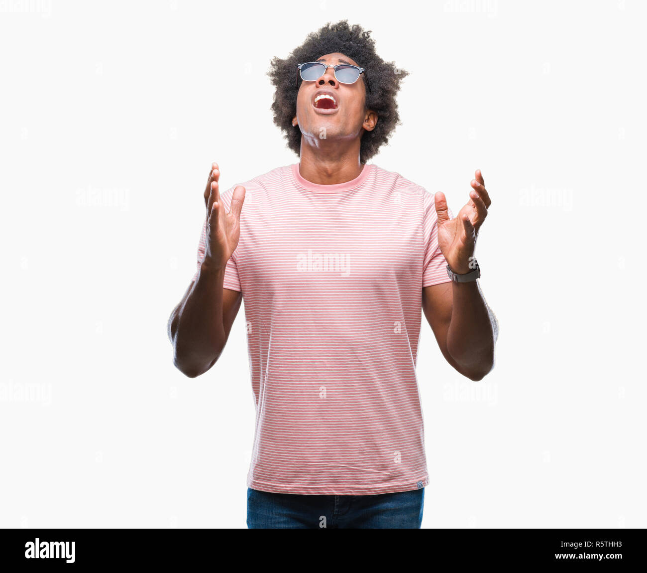 Afro american man wearing sunglasses over isolated background crazy and ...