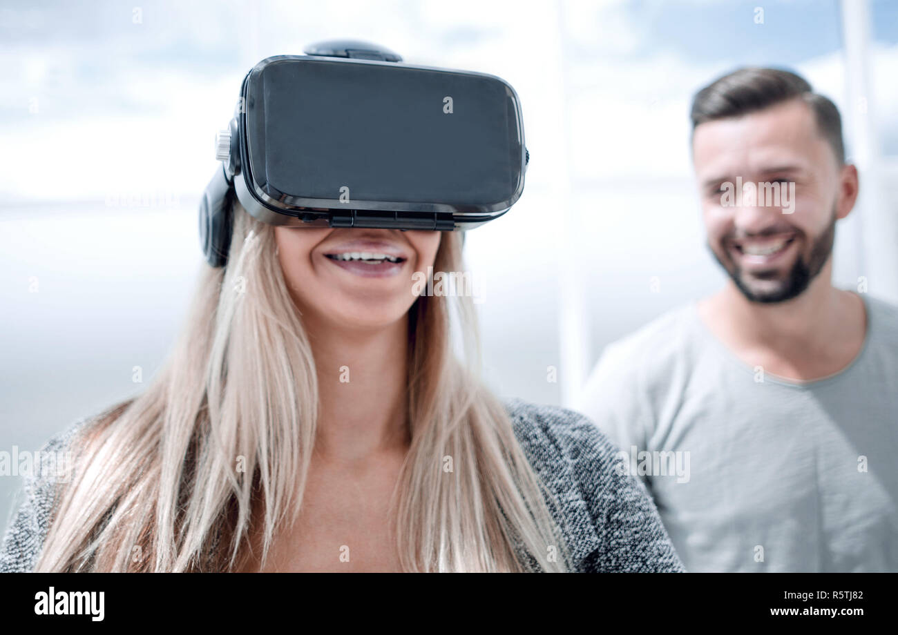 Girl in VR glasses of virtual reality with gamepad playing game Stock ...