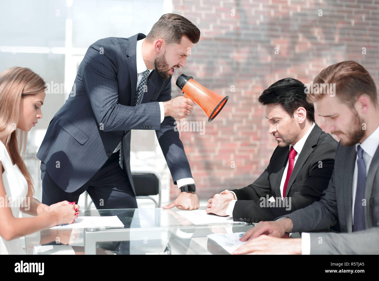 businessman yelling at his colleagues through a megaphone Stock Photo ...