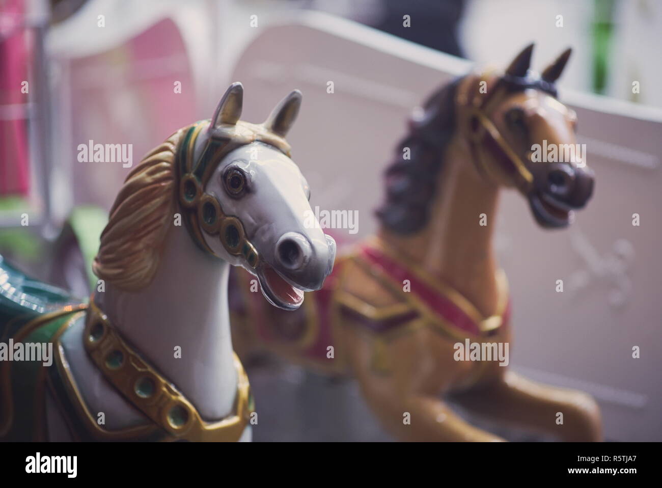 White and Brown Carousel Horses at Night Closeup Stock Photo - Alamy