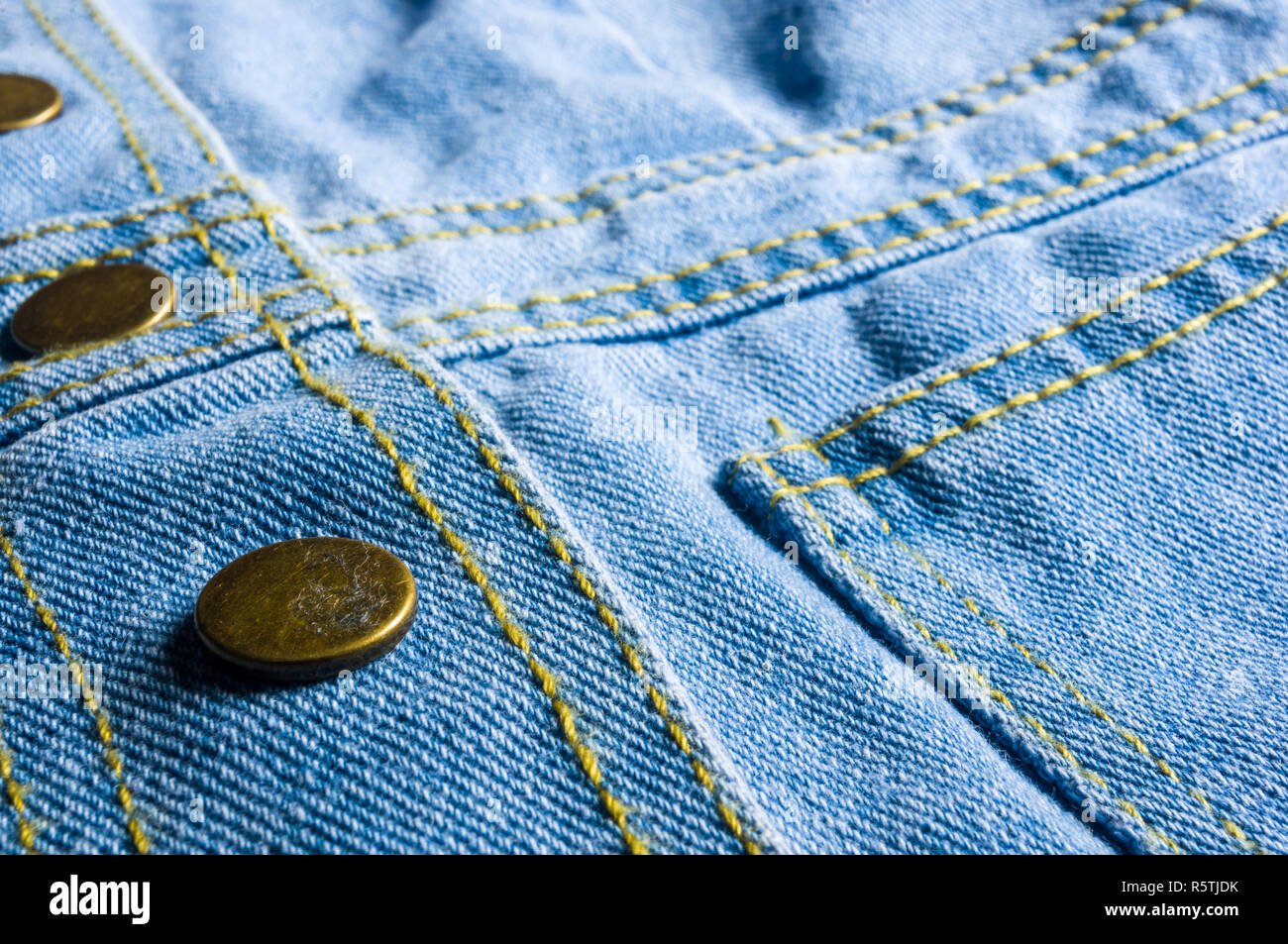 Blue washed faded jeans texture with seams, clasps, buttons and rivets ...