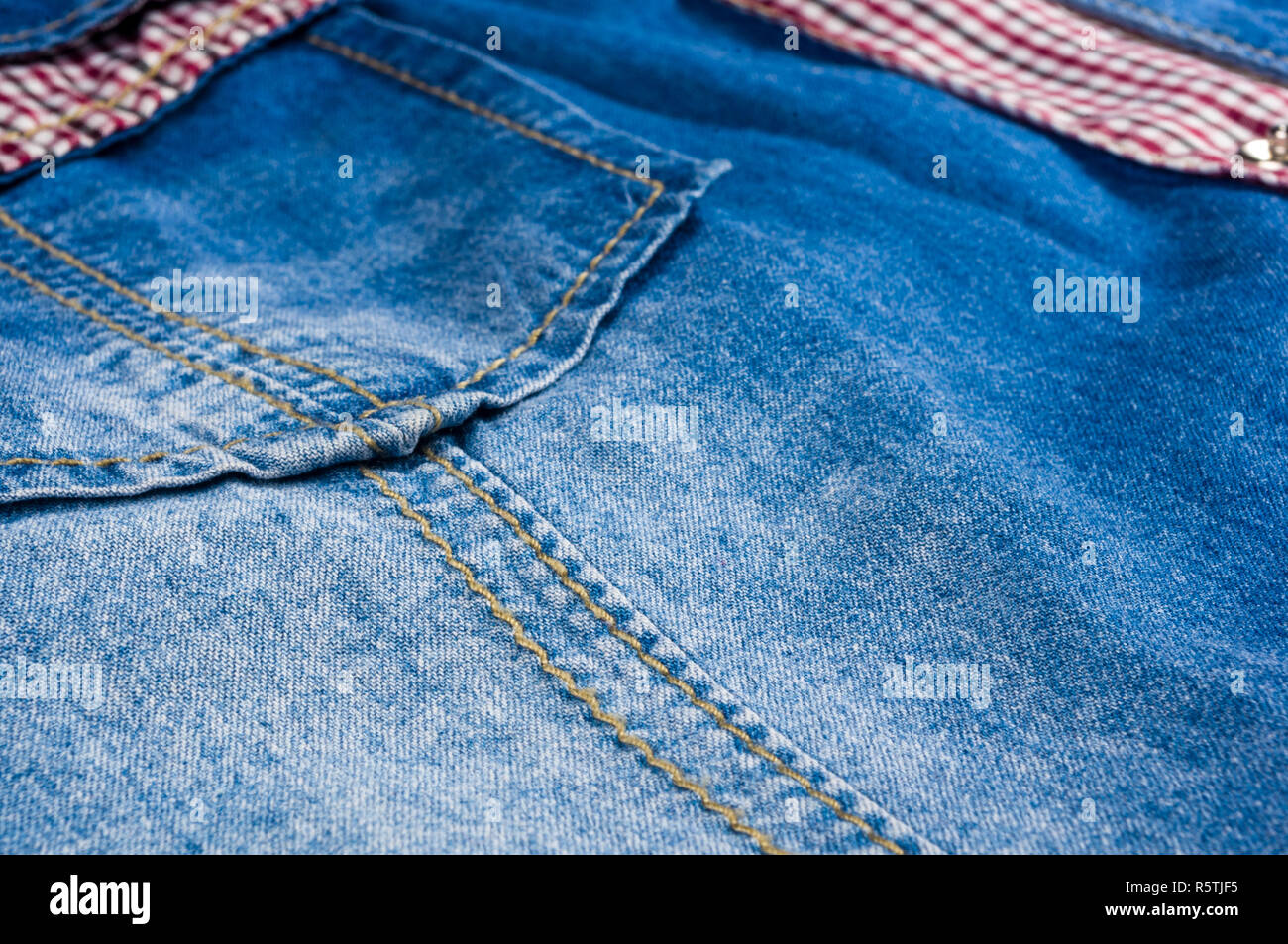 Blue washed faded jeans texture with seams, clasps, buttons and rivets ...
