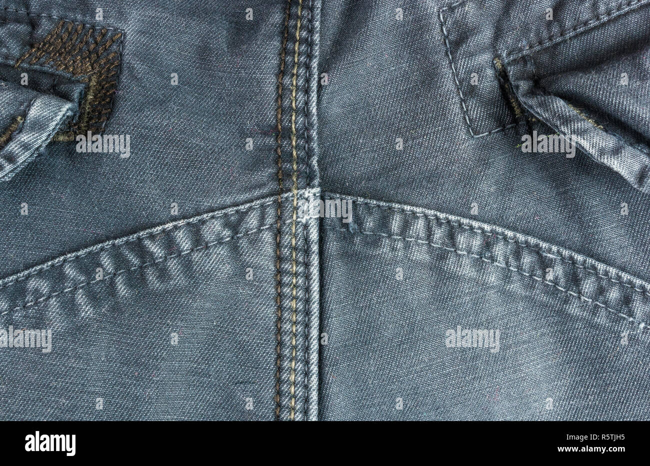 clothing items washed cotton fabric texture with seams, macro, close-up ...