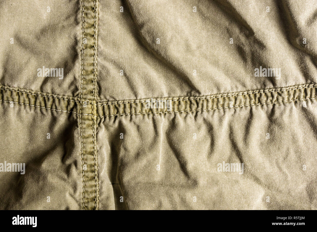 clothing items washed cotton fabric texture with seams, macro, close-up ...