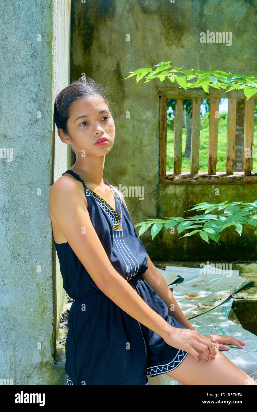 Beautiful woman posing - sitting, leaning, thinking, looking away Stock ...