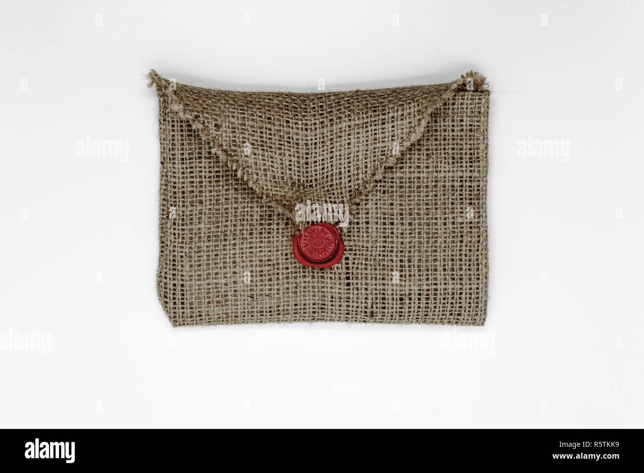 Canvas envelope sealed with red wax and isolated on white background ...