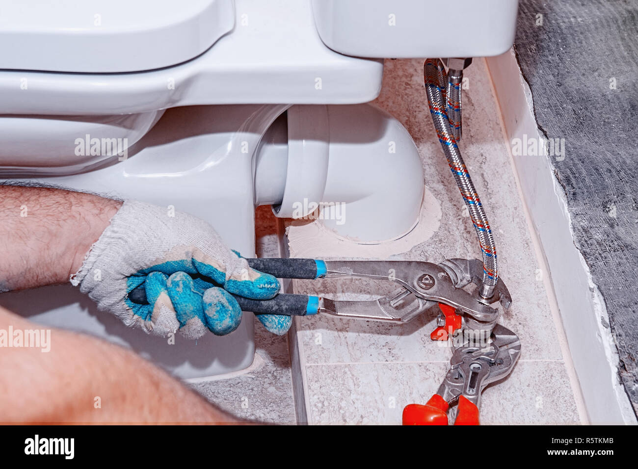 Residential repair, replace the valve valve, plumbing closeup, hand red ...