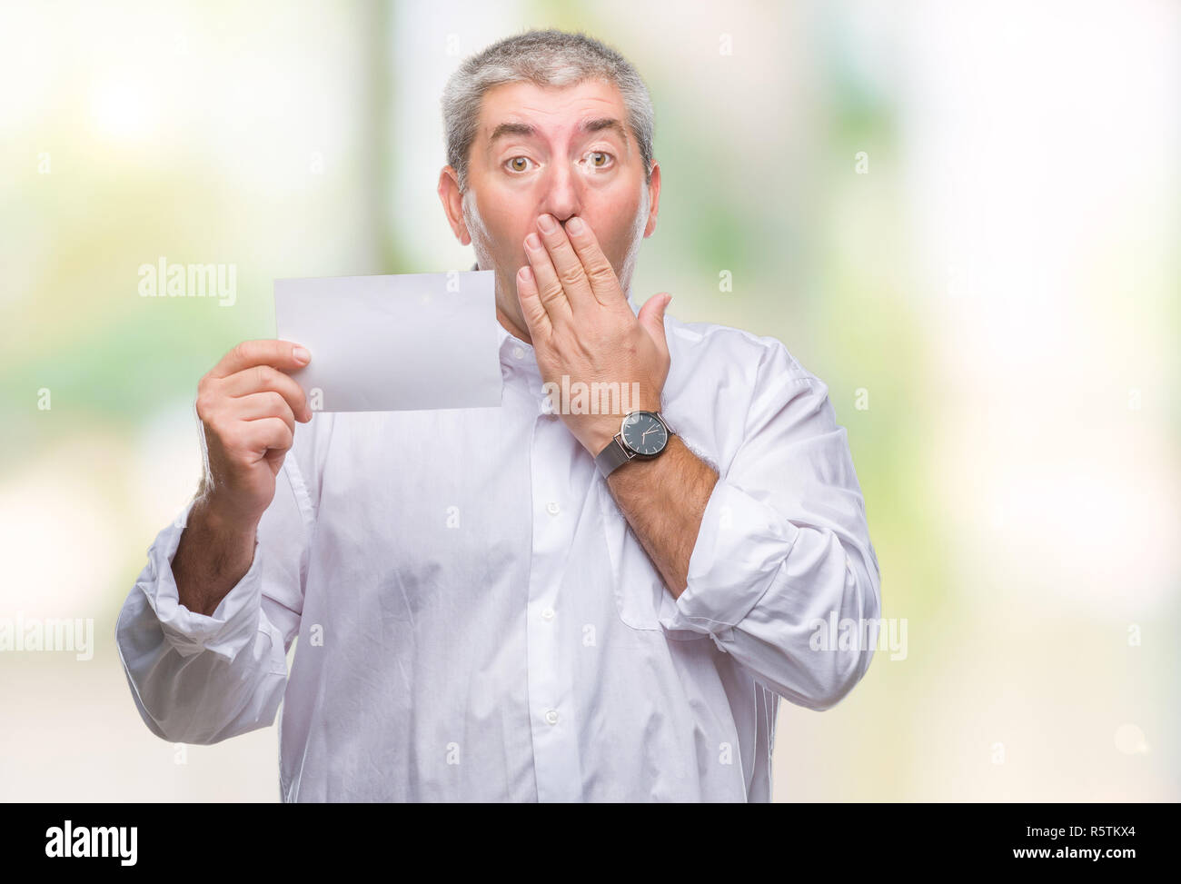 Handsome senior man holding blank card over isolated background cover ...