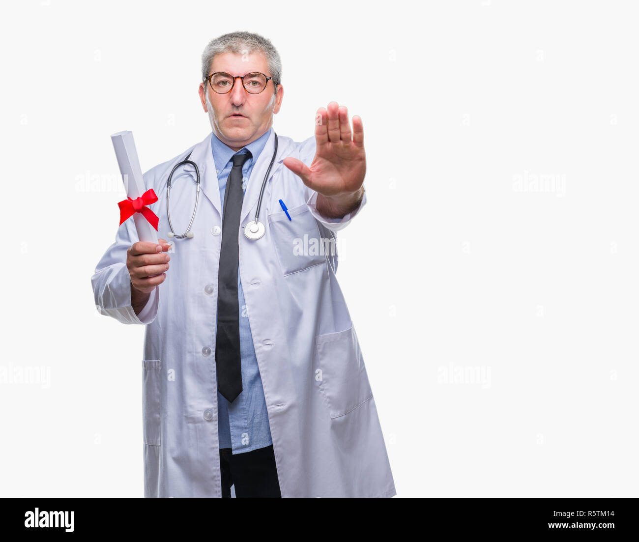 Handsome senior doctor man holding degree paper over isolated ...