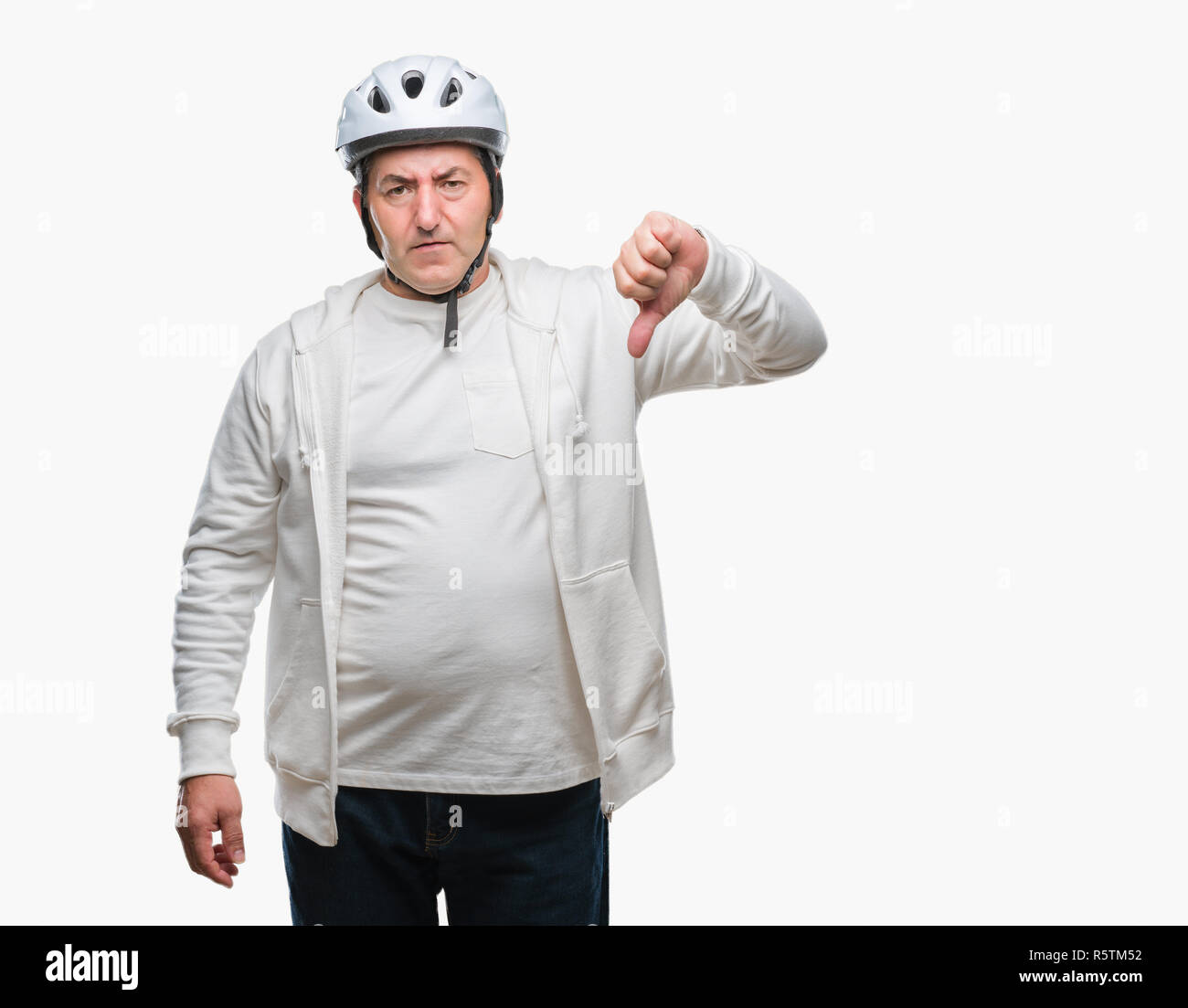 Handsome senior cyclist man wearing bike helmet over isolated ...