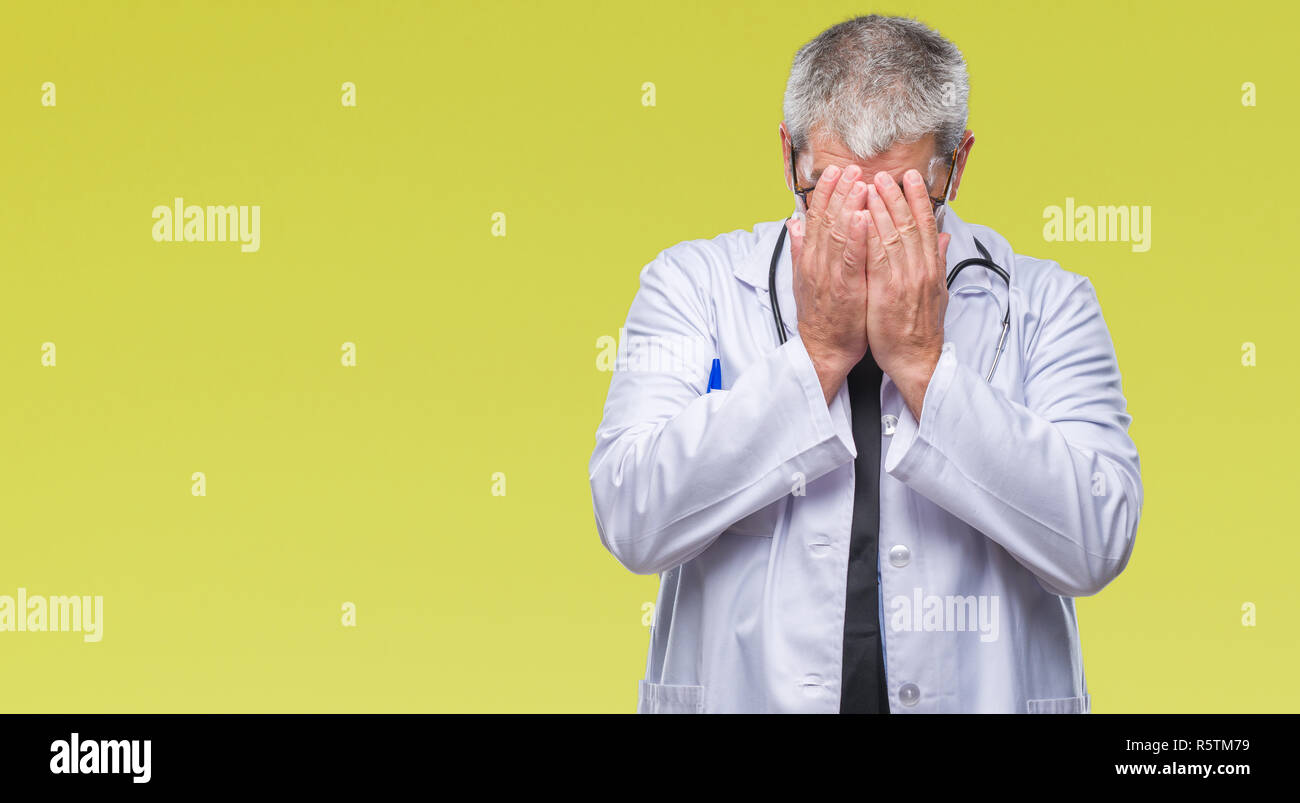 Handsome senior doctor man over isolated background with sad expression ...