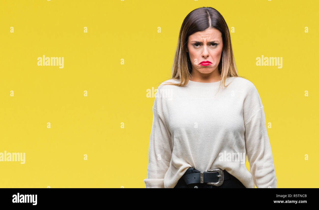 Young beautiful woman casual white sweater over isolated background ...