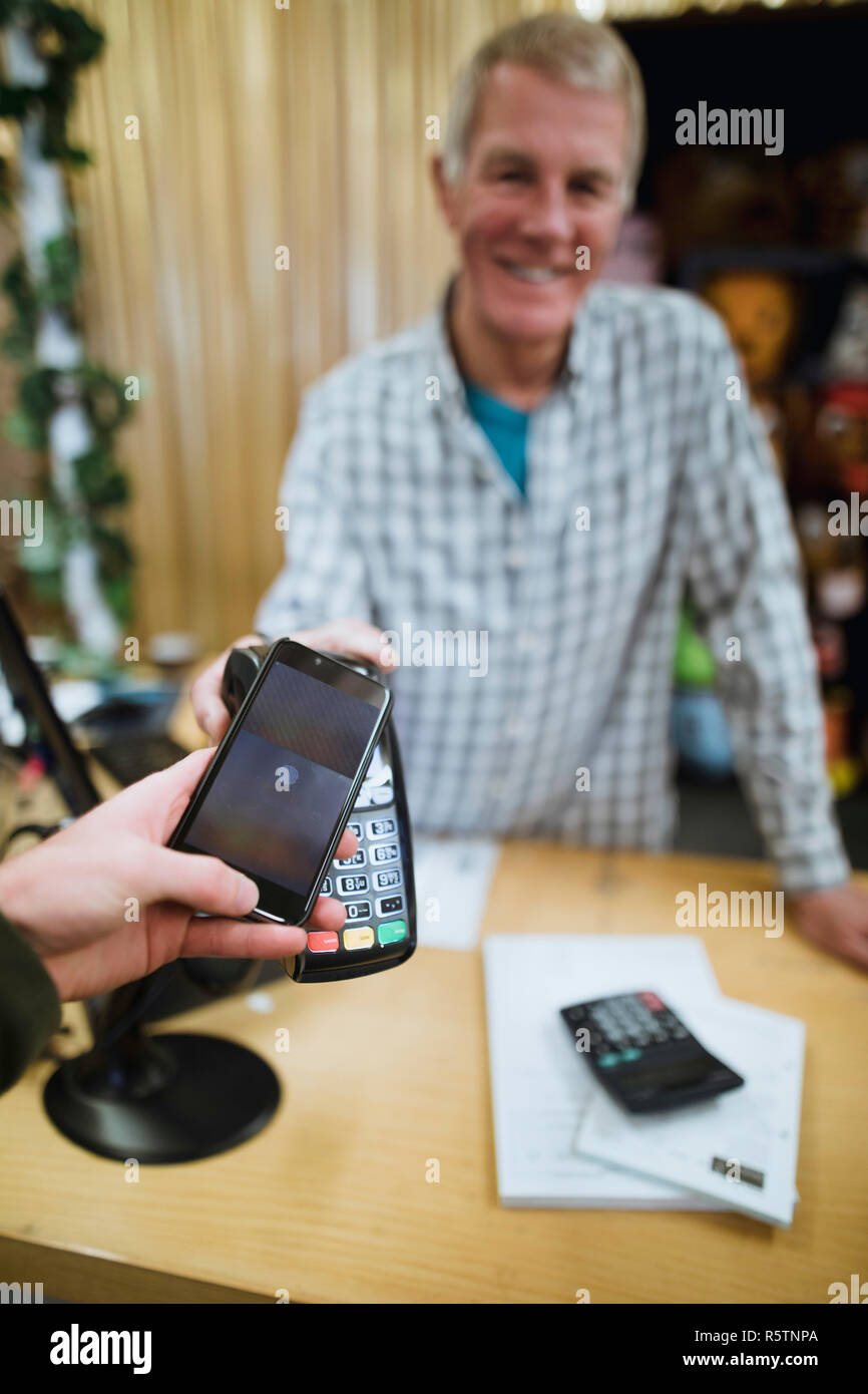 Making A Smart Phone Payment Stock Photo - Alamy