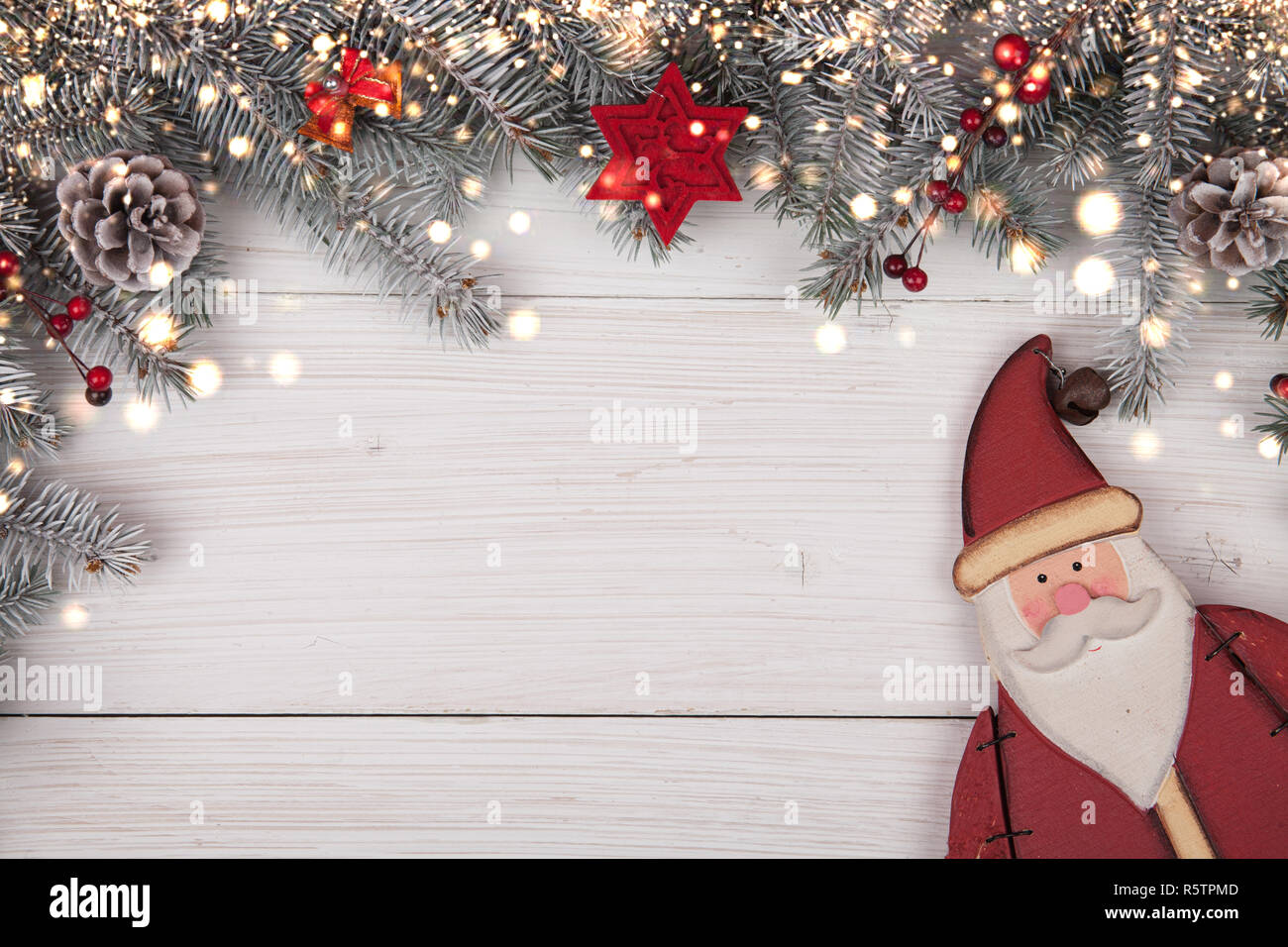 Christmas background on the white wooden background with Santa Claus ...