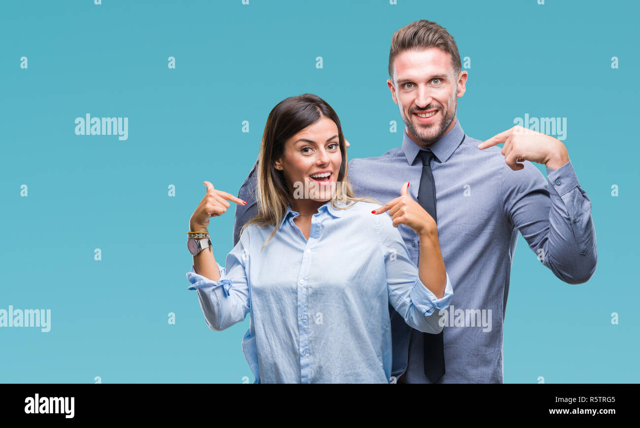 Young workers business couple over isolated background looking ...