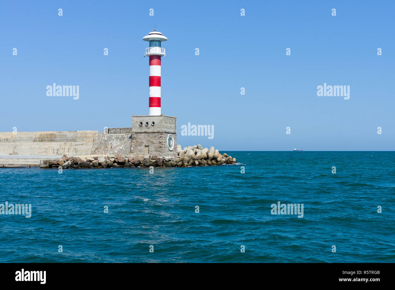 Lighthouse at the entrance to the water area of the sea port of Burgas ...