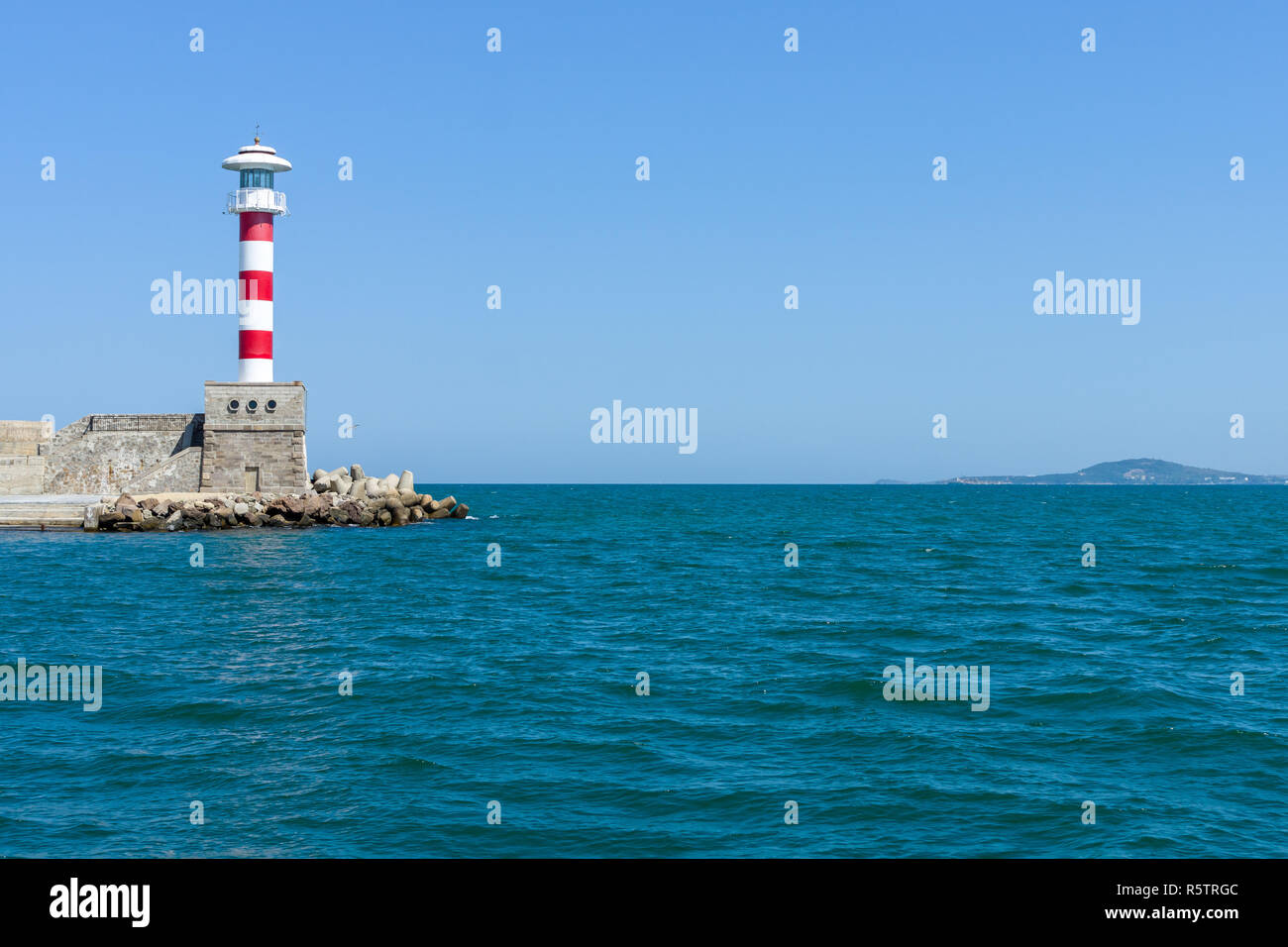 Lighthouse at the entrance to the water area of the sea port of Burgas ...