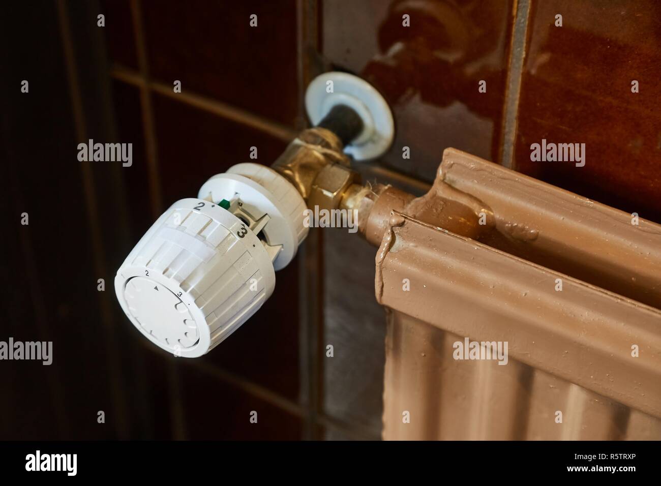 Radiator with tiled wall Stock Photo - Alamy