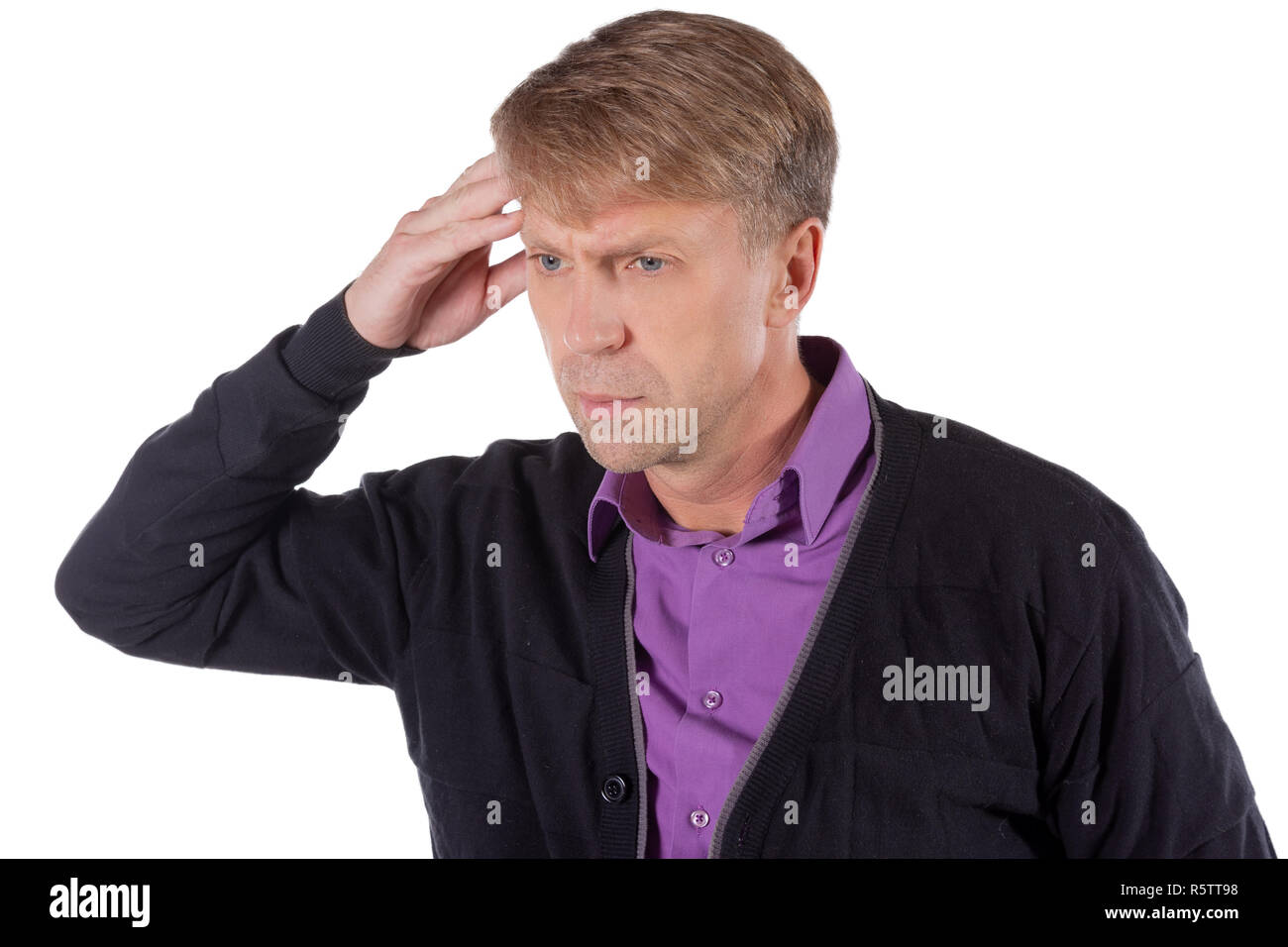 A man holds his hands on his head on white background Stock Photo - Alamy