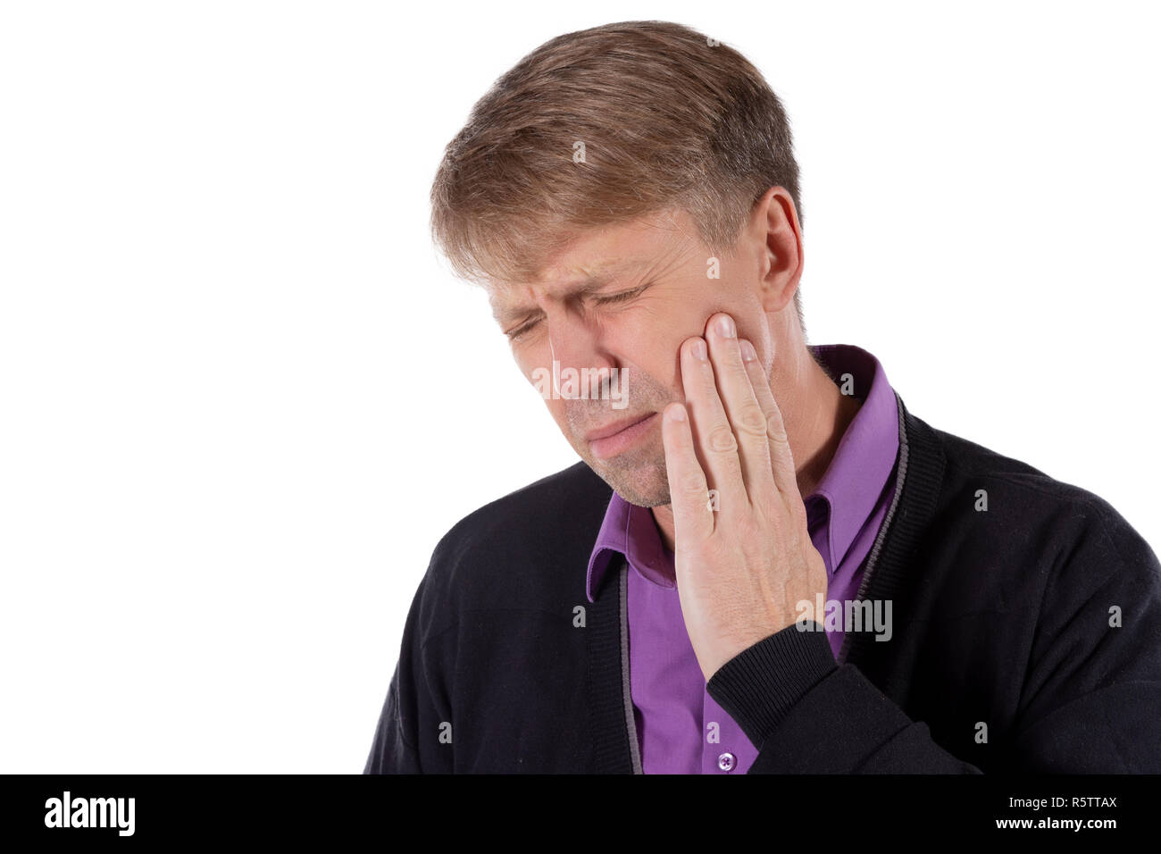 Sad depressed man in pain holding his cheek. Portrait of a man on white ...