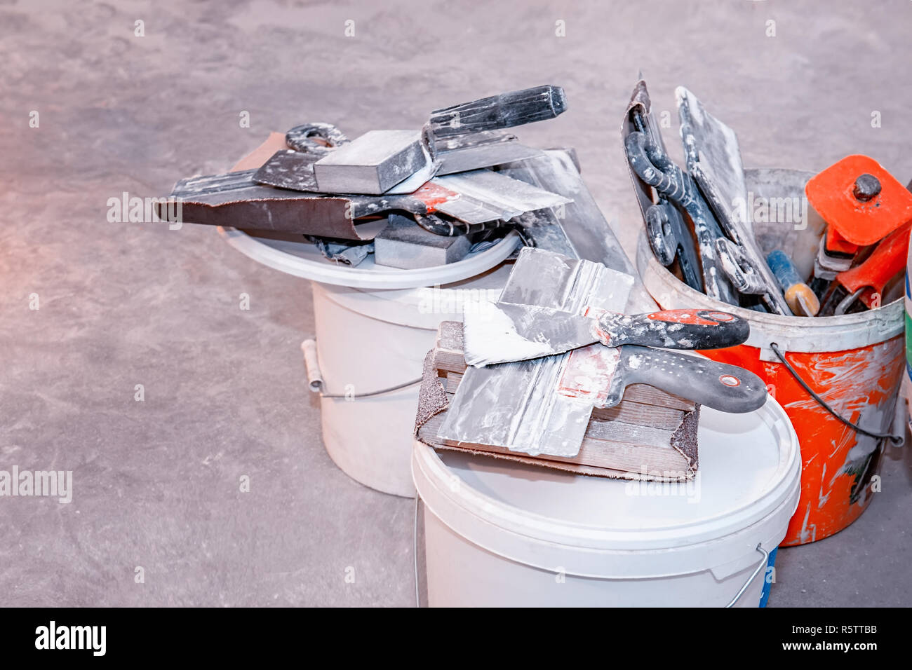 Finishing tools. Brush paint and steel plate spatula used for putty and ...