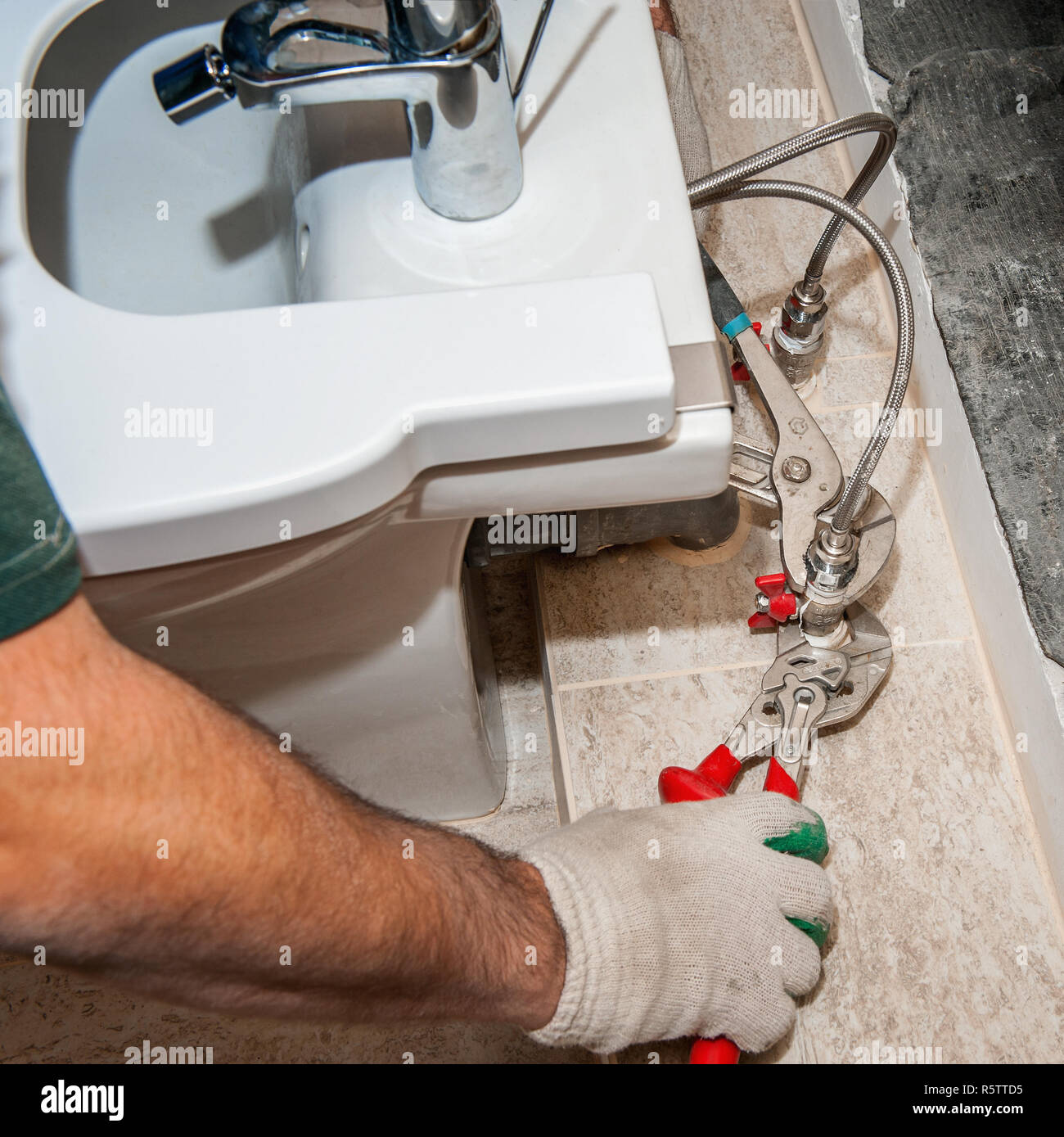 Residential repair, replace the valve valve, plumbing closeup, hand red ...