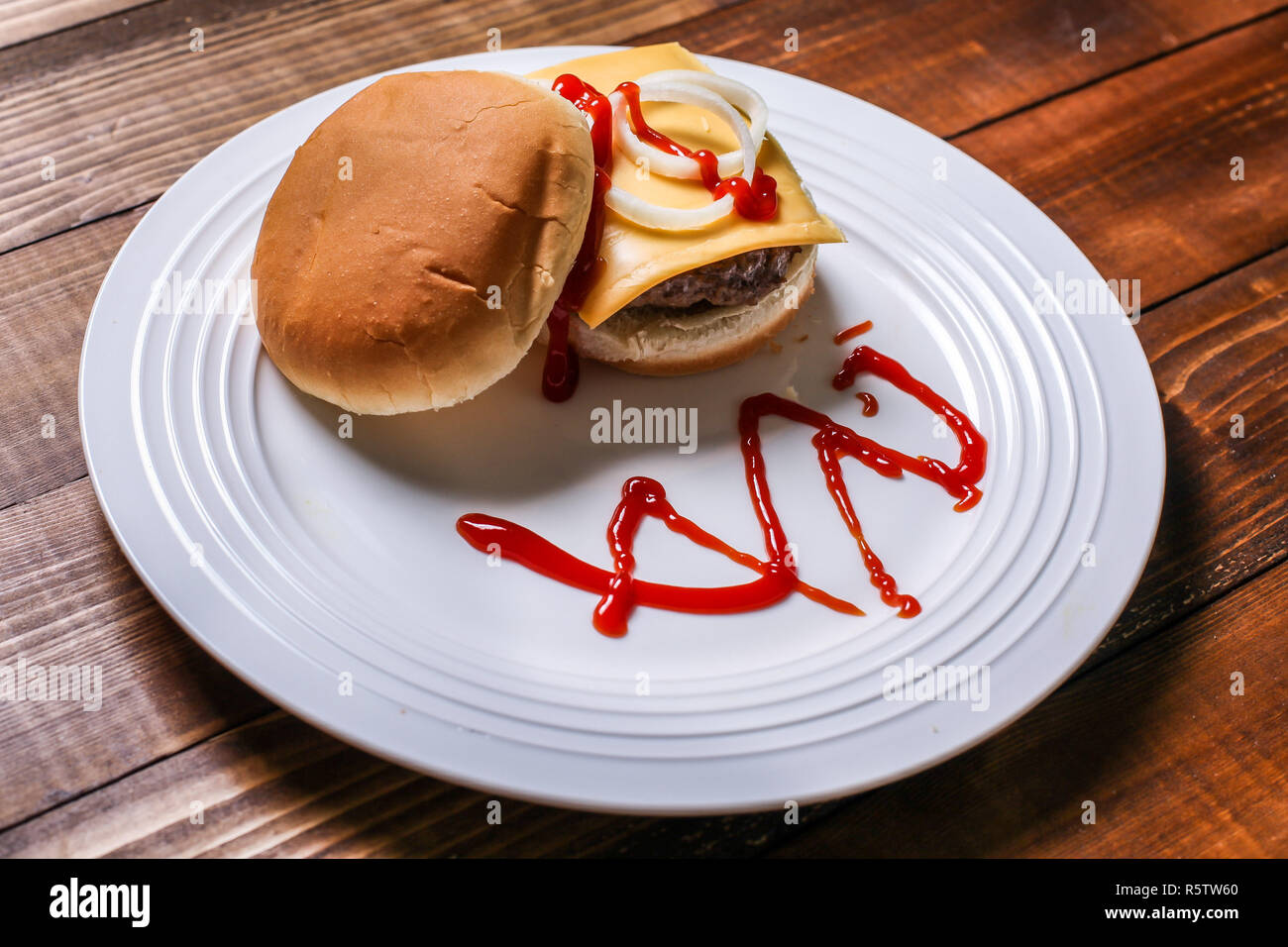 Burger on the plate hi-res stock photography and images - Alamy