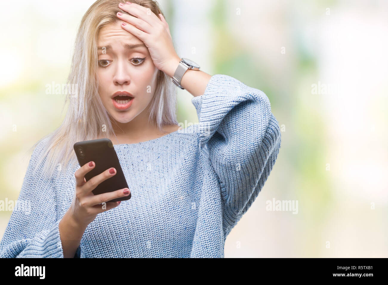Young blonde woman texting sending message using smartphone over ...