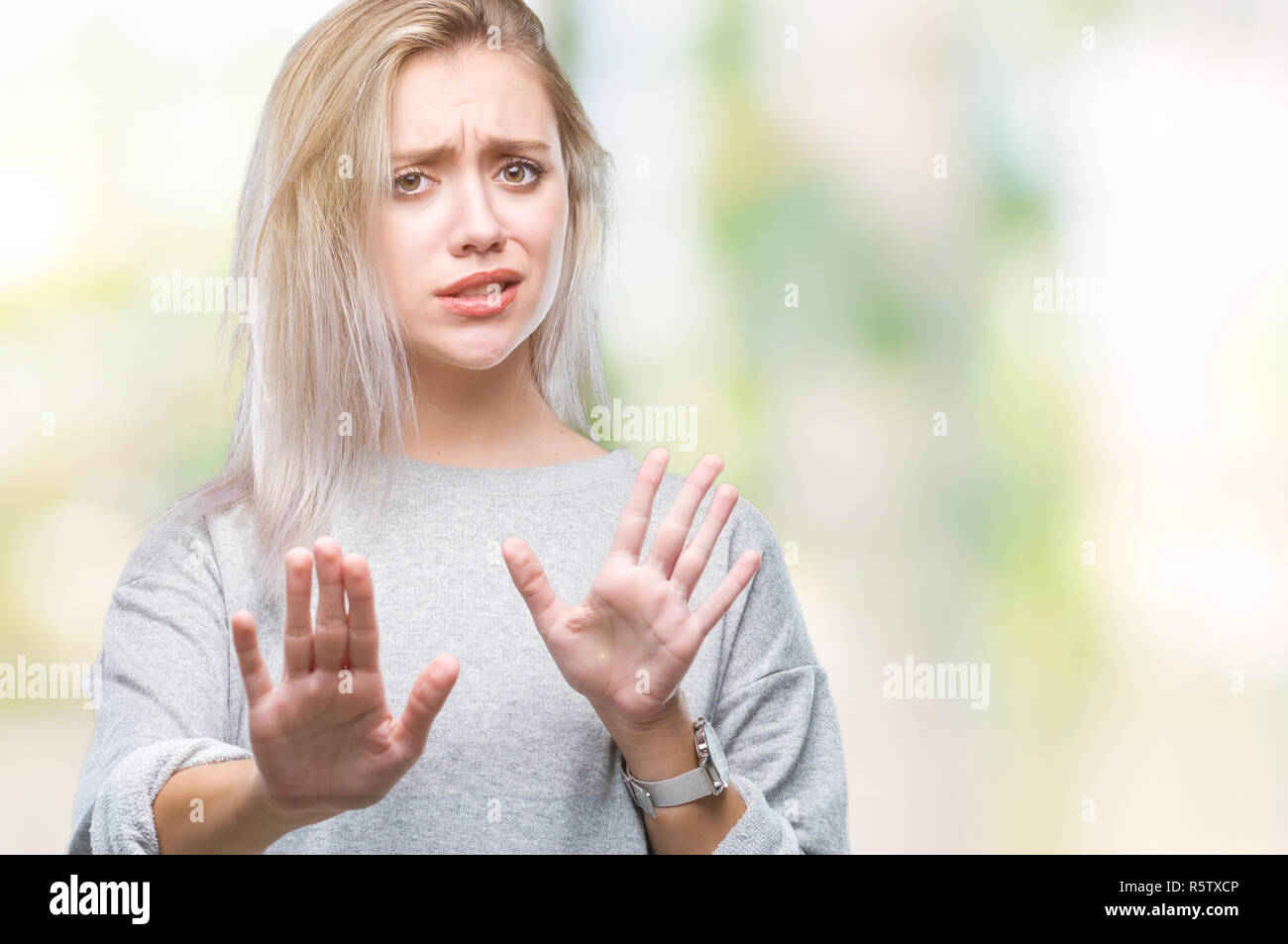 Young blonde woman over isolated background disgusted expression ...