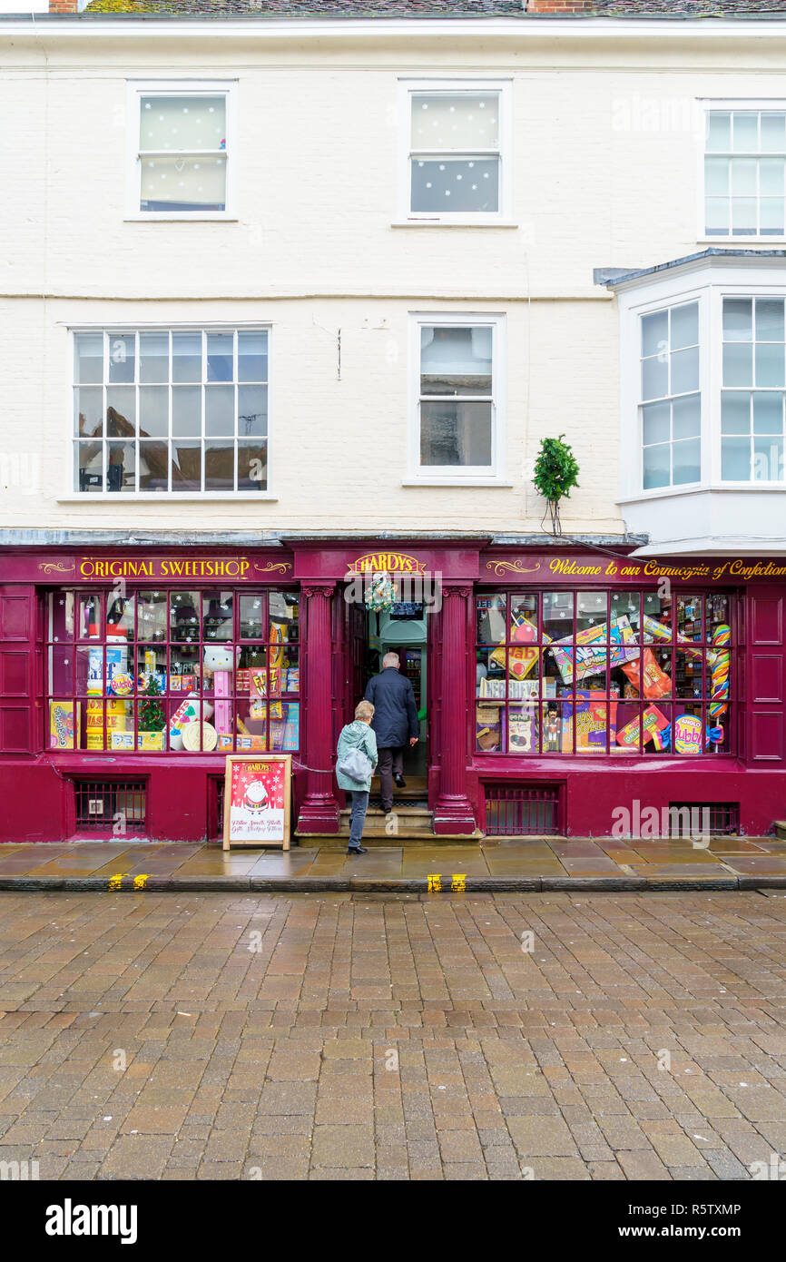 Couple entering Hardy's traditional sweet shop in Salisbury UK Stock ...