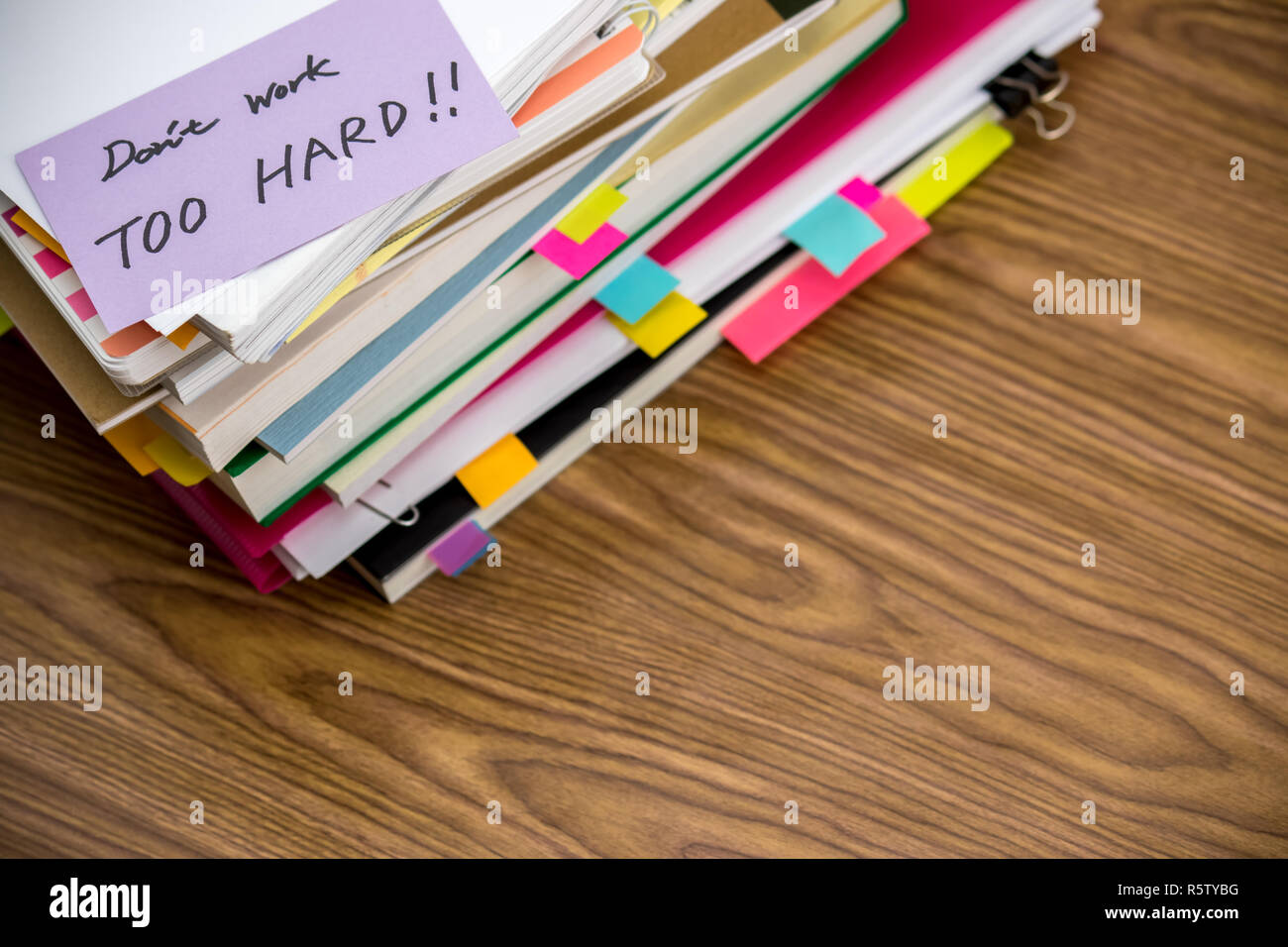 Don't Work Too Hard The Pile of Business Documents on the Desk Stock ...