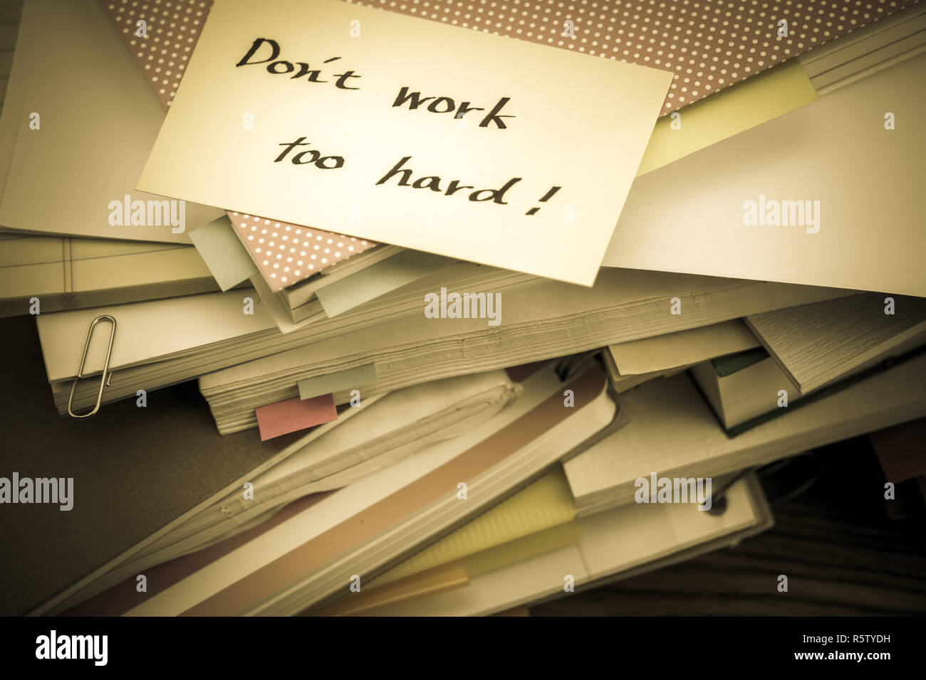 Don't Work Too Hard The Pile of Business Documents on the Desk Stock ...