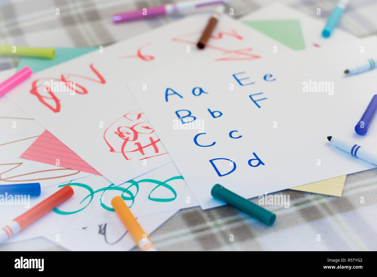 English Kids Writing Some English Alphabet for Practice Stock Photo - Alamy