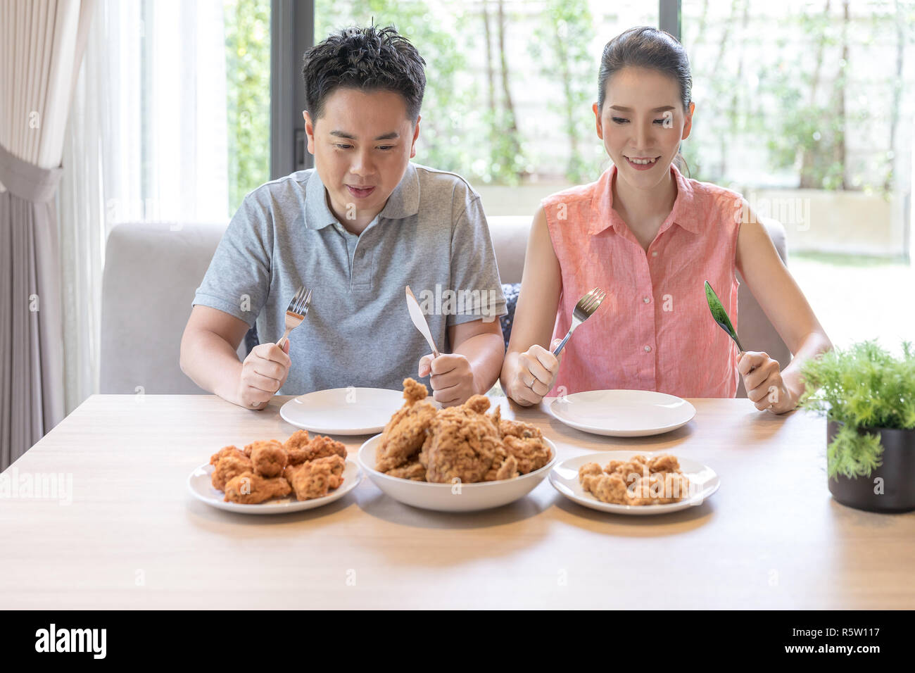Couples eating together Stock Photo - Alamy